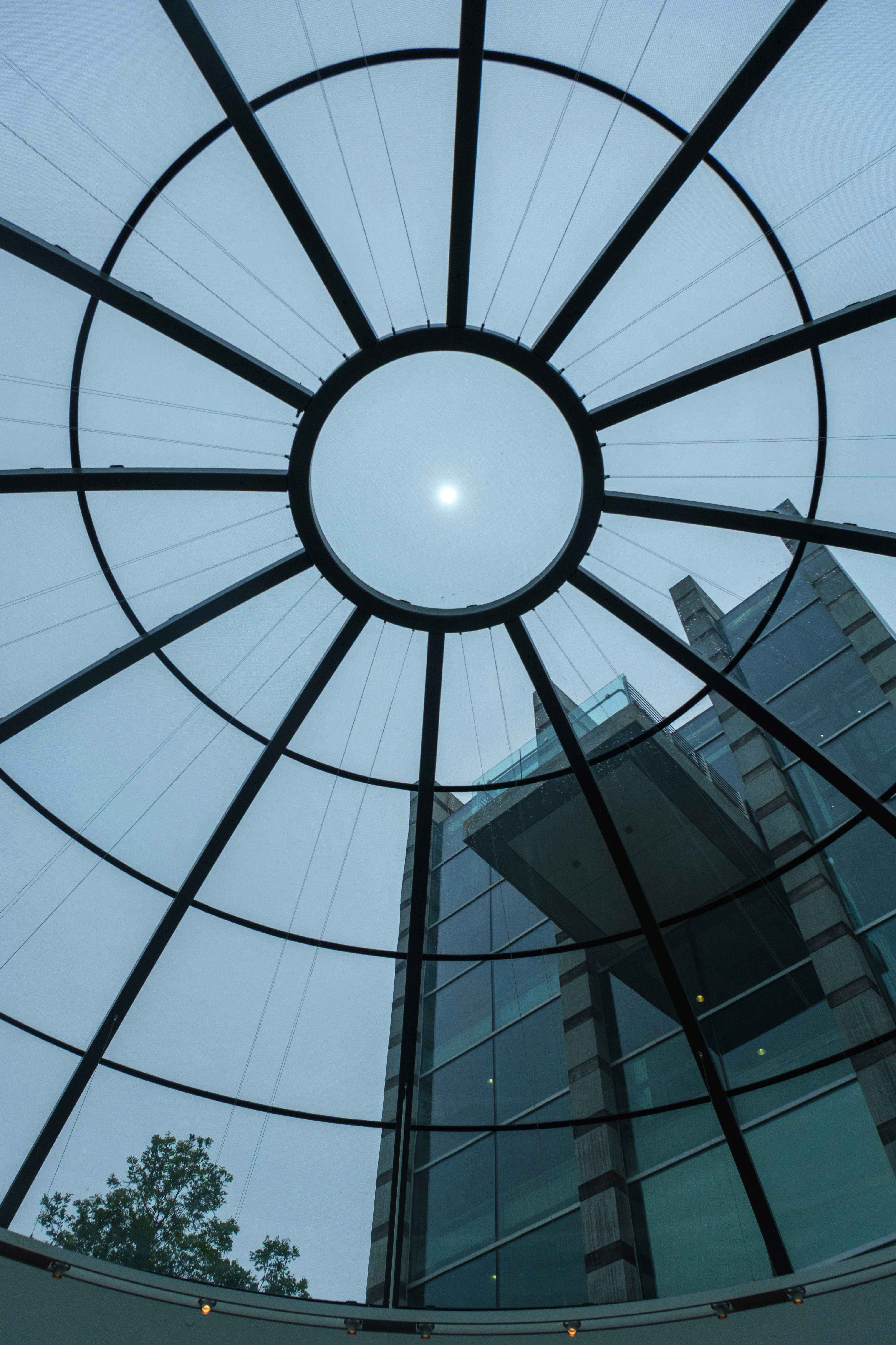 Circular Glass Sky: A Radiant Hub of Steel and Sky
