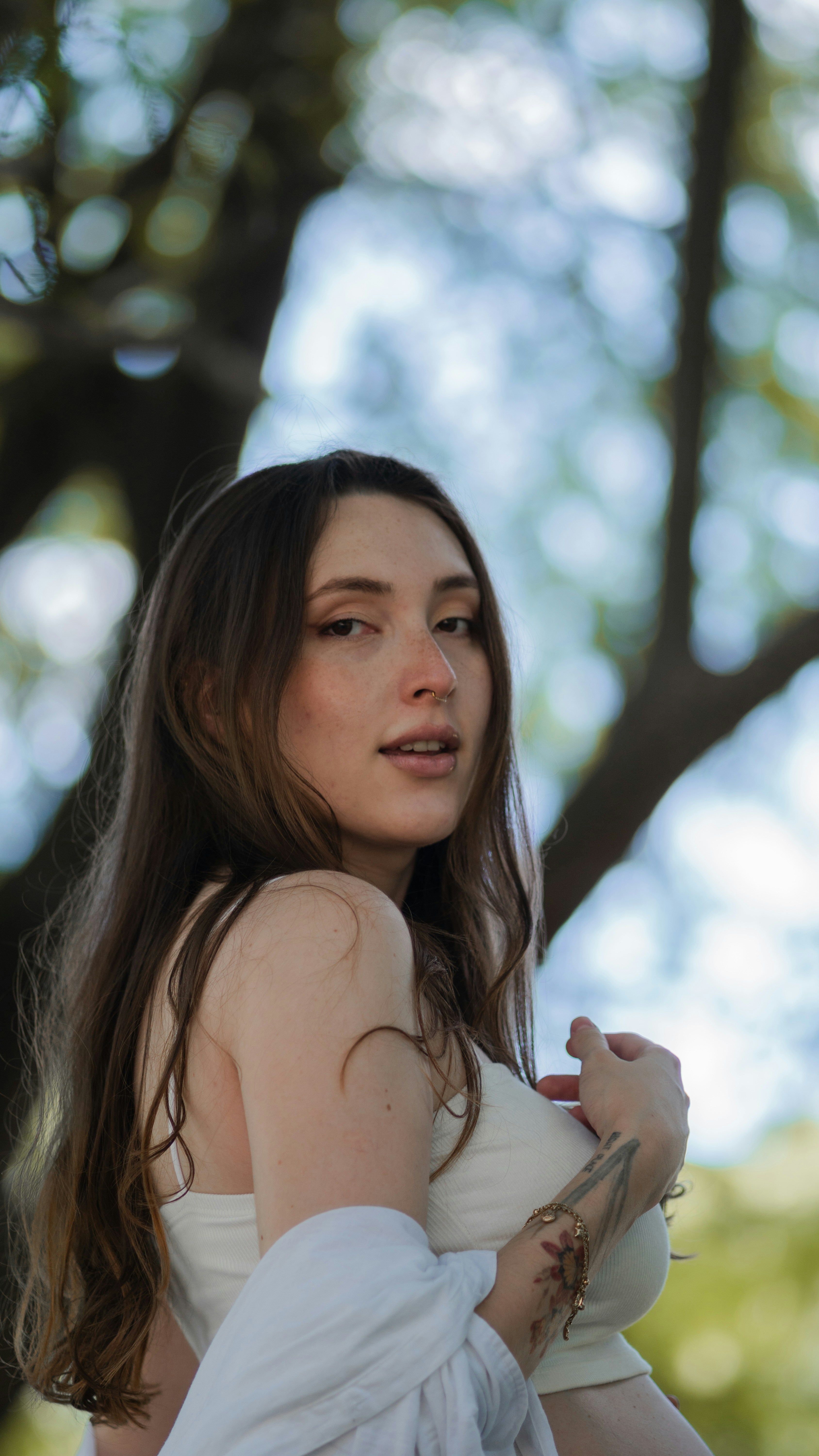 Eyes in the Forest: A Portrait Beneath Dappled Light