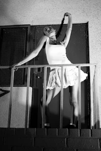 Grace on the Balcony: A Neon-Contrast Pose