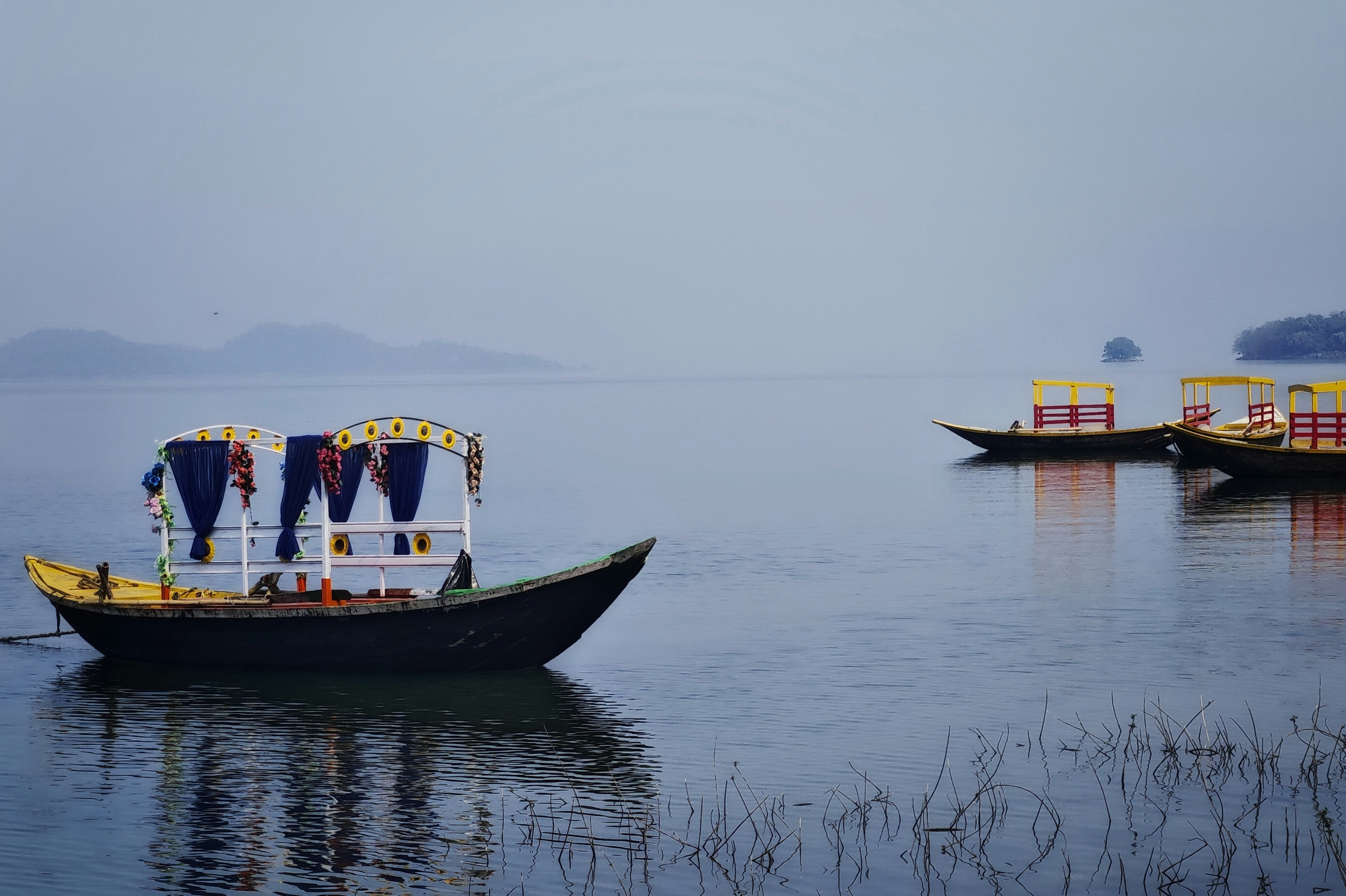 Floating Lanterns: Tranquil Boats in a Misty Harbor
