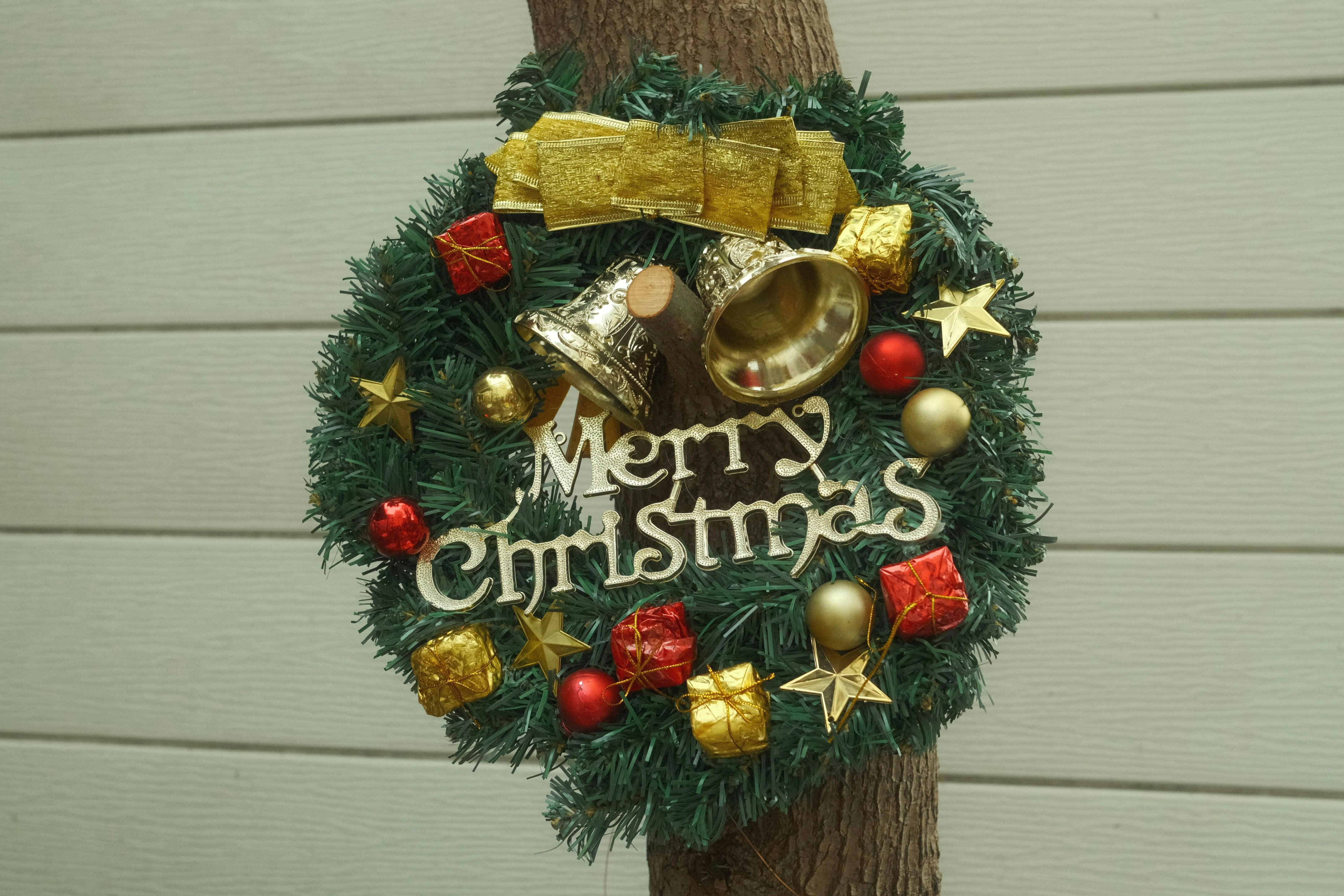 A christmas wreath with bells and ornaments
