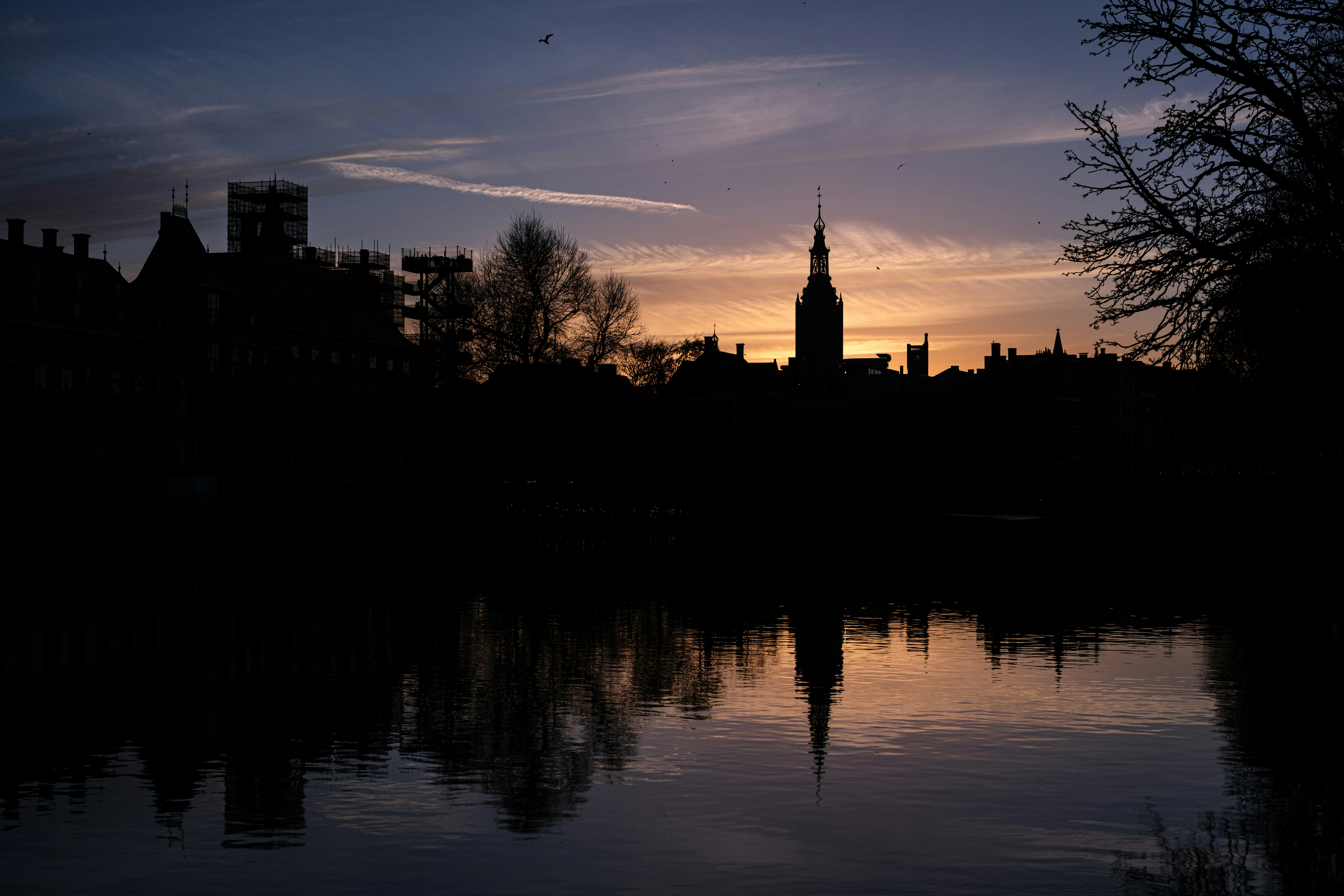 Dusk Silhouette Over a Calm River