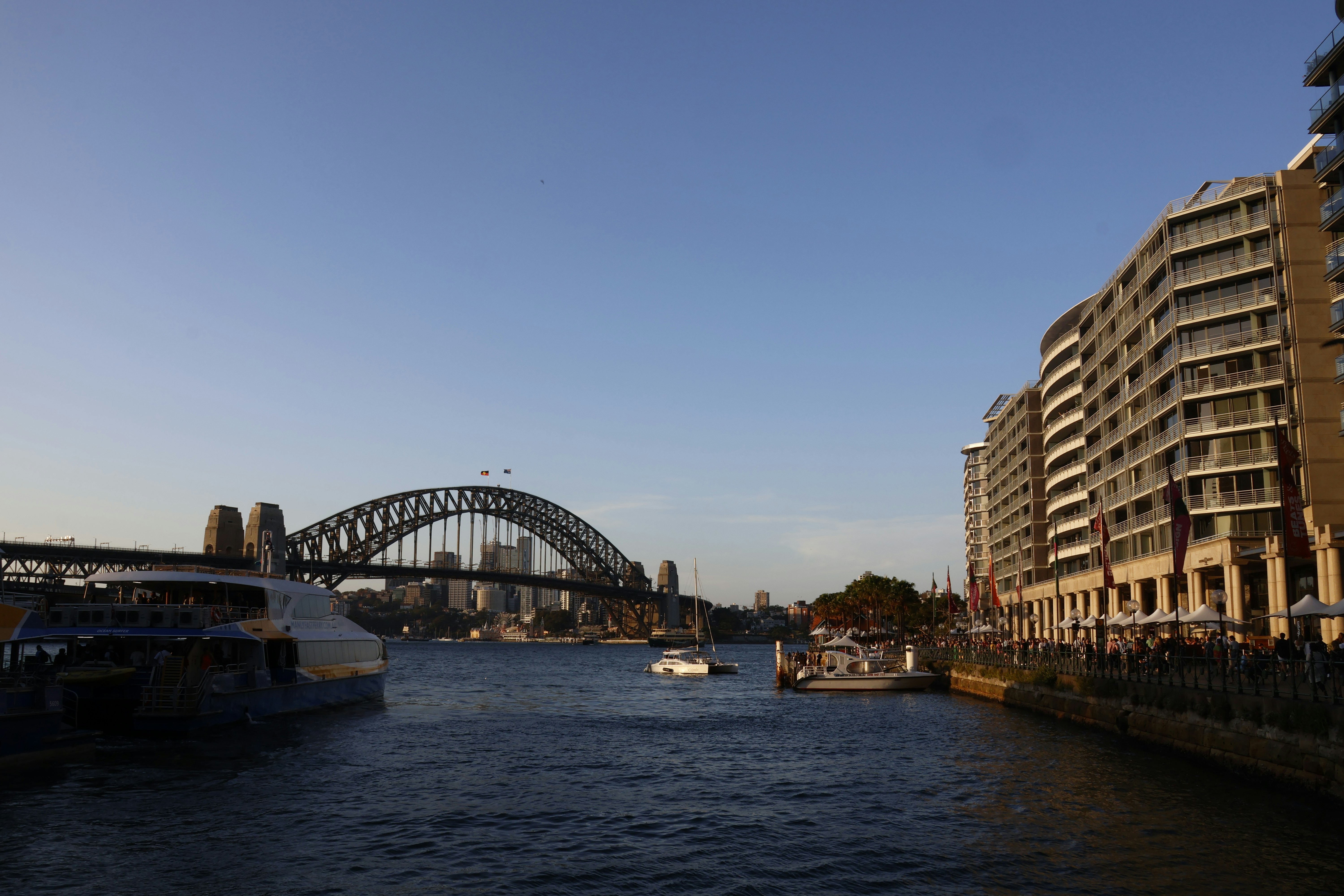Harbor Slice: Boats, Bridge, and Modern Riverside