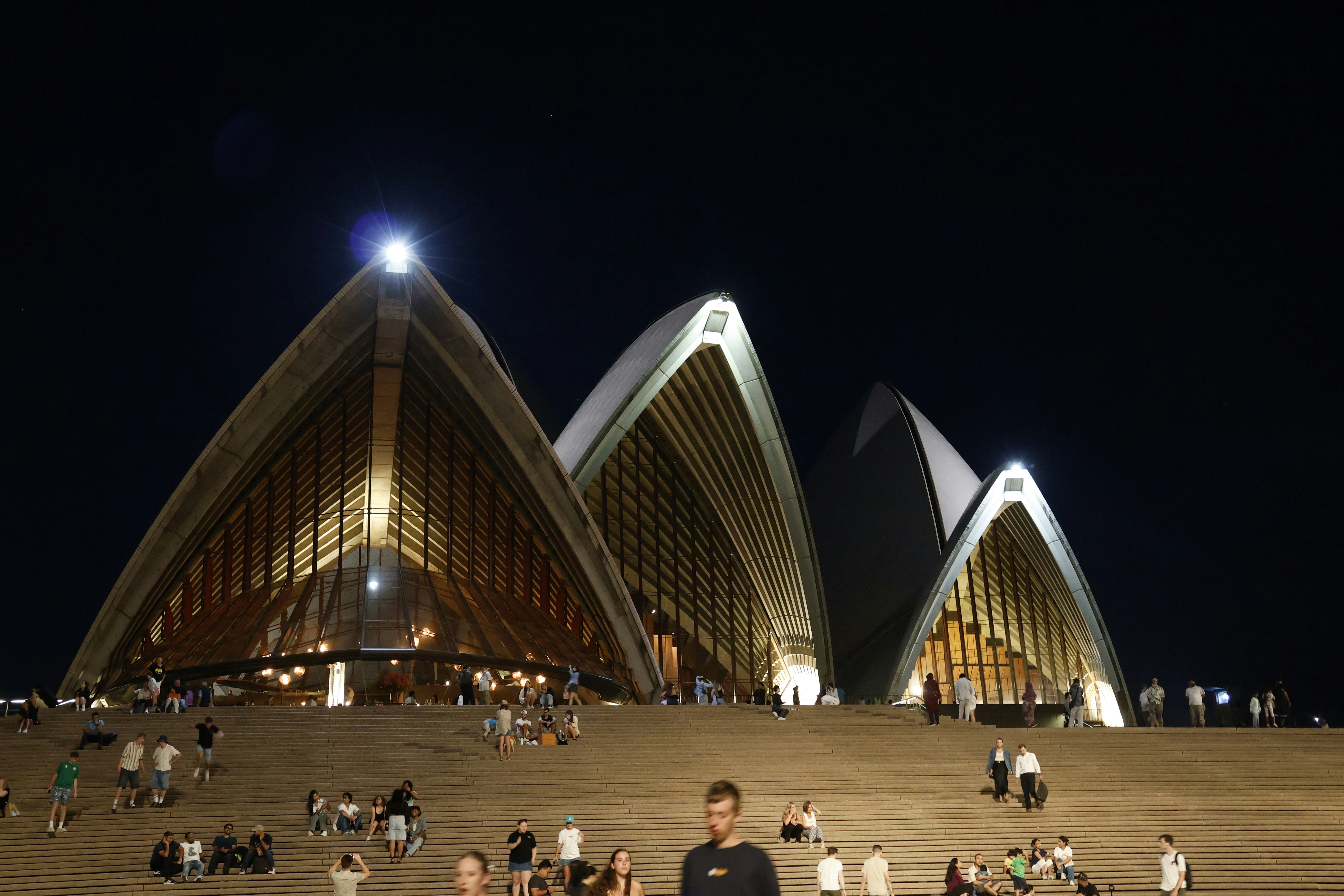Night at the Opera Steps: People, Light, and the Iconic Tri-Sails