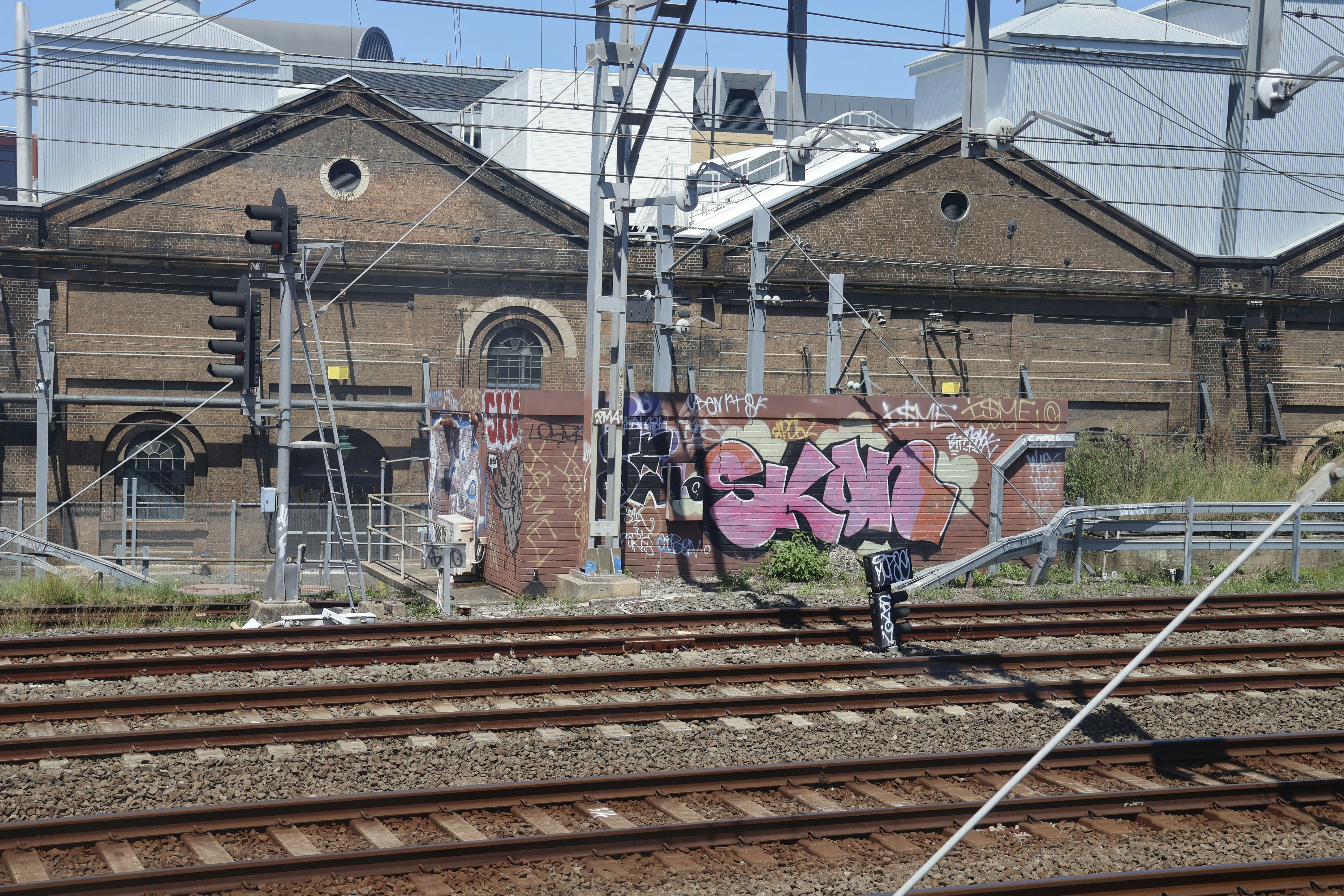 Graffiti Siege in an Industrial Backdrop