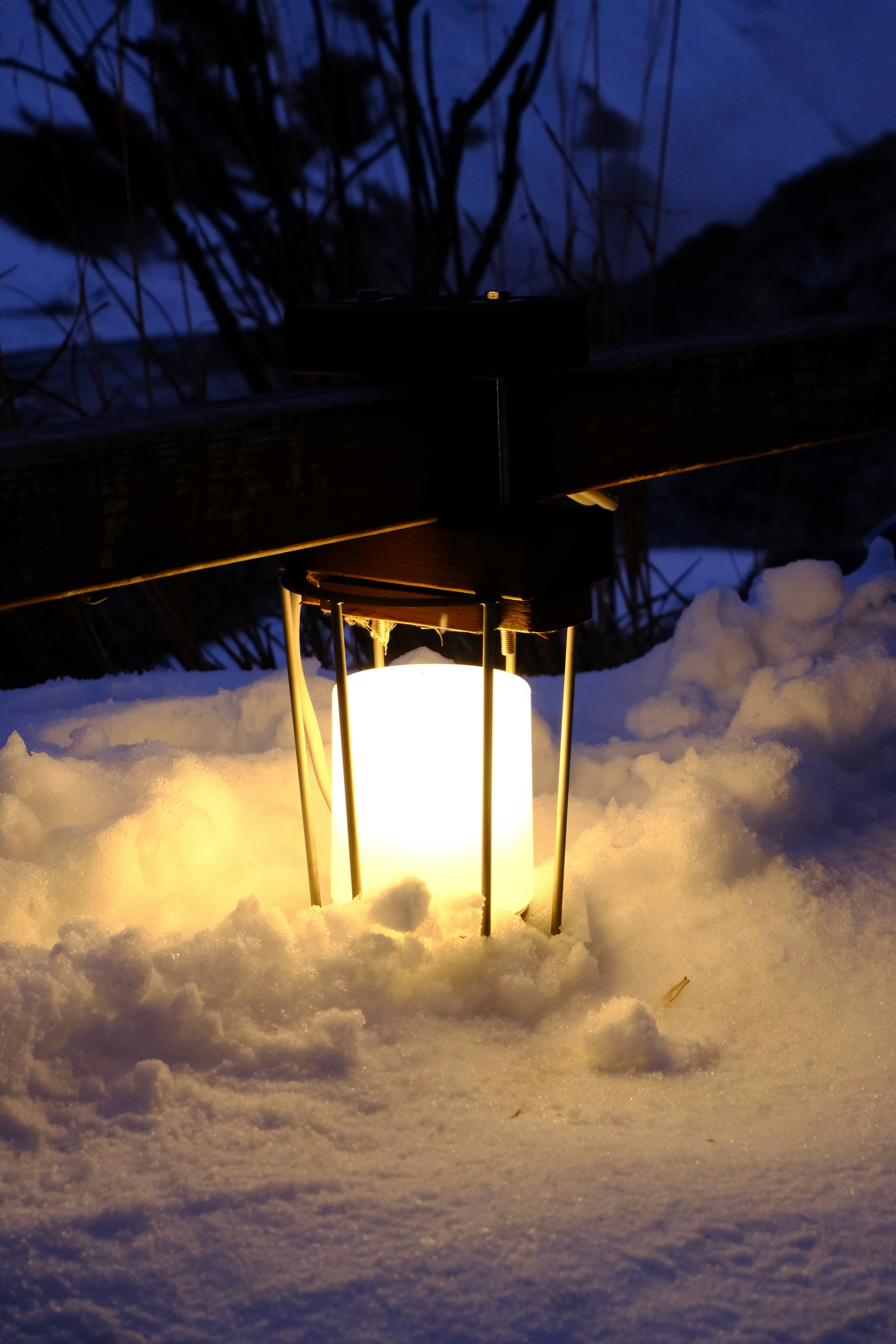 Glowing Lantern Emerges from the Snow