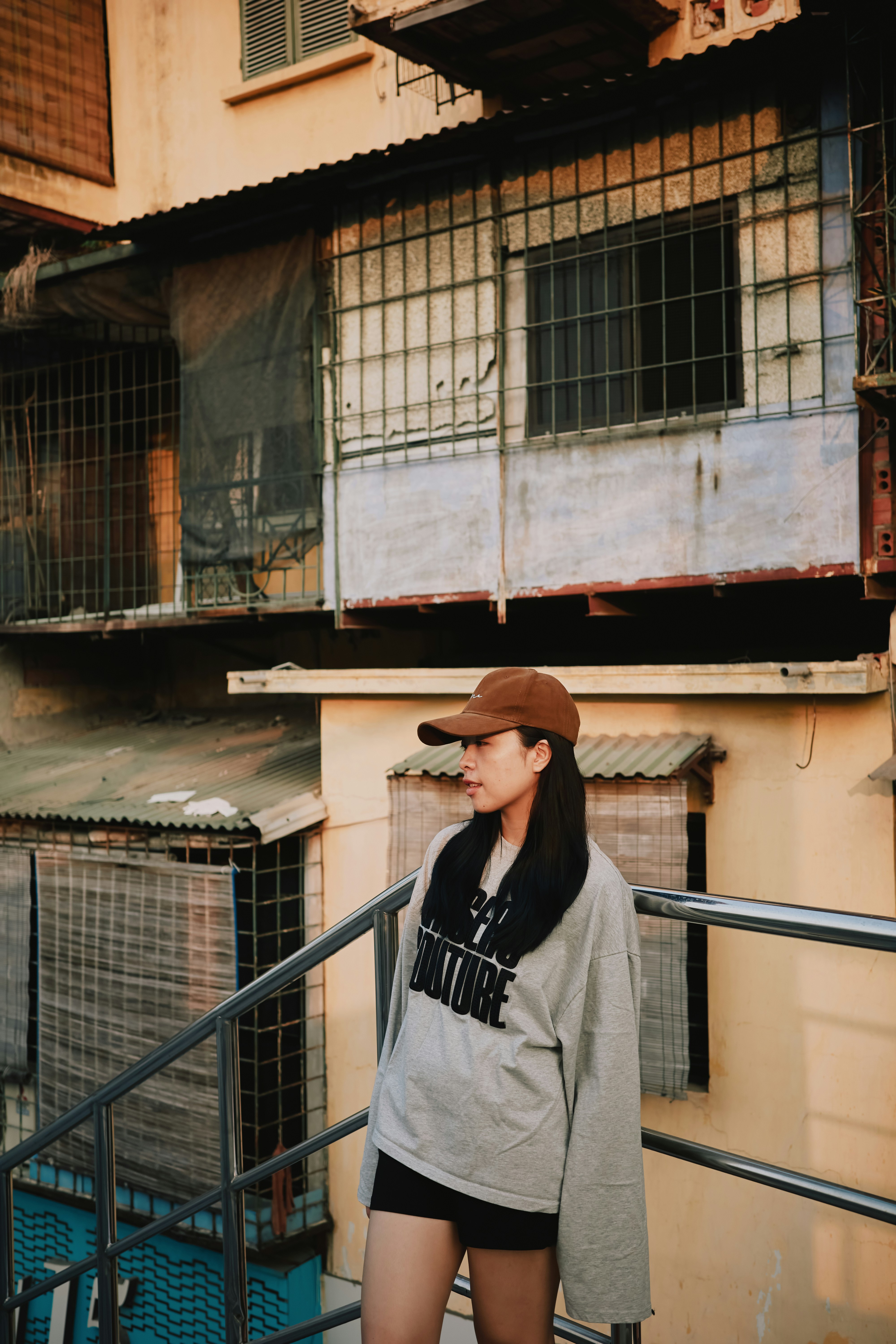 Casual streetbound: a quiet glance on a sunlit balcony