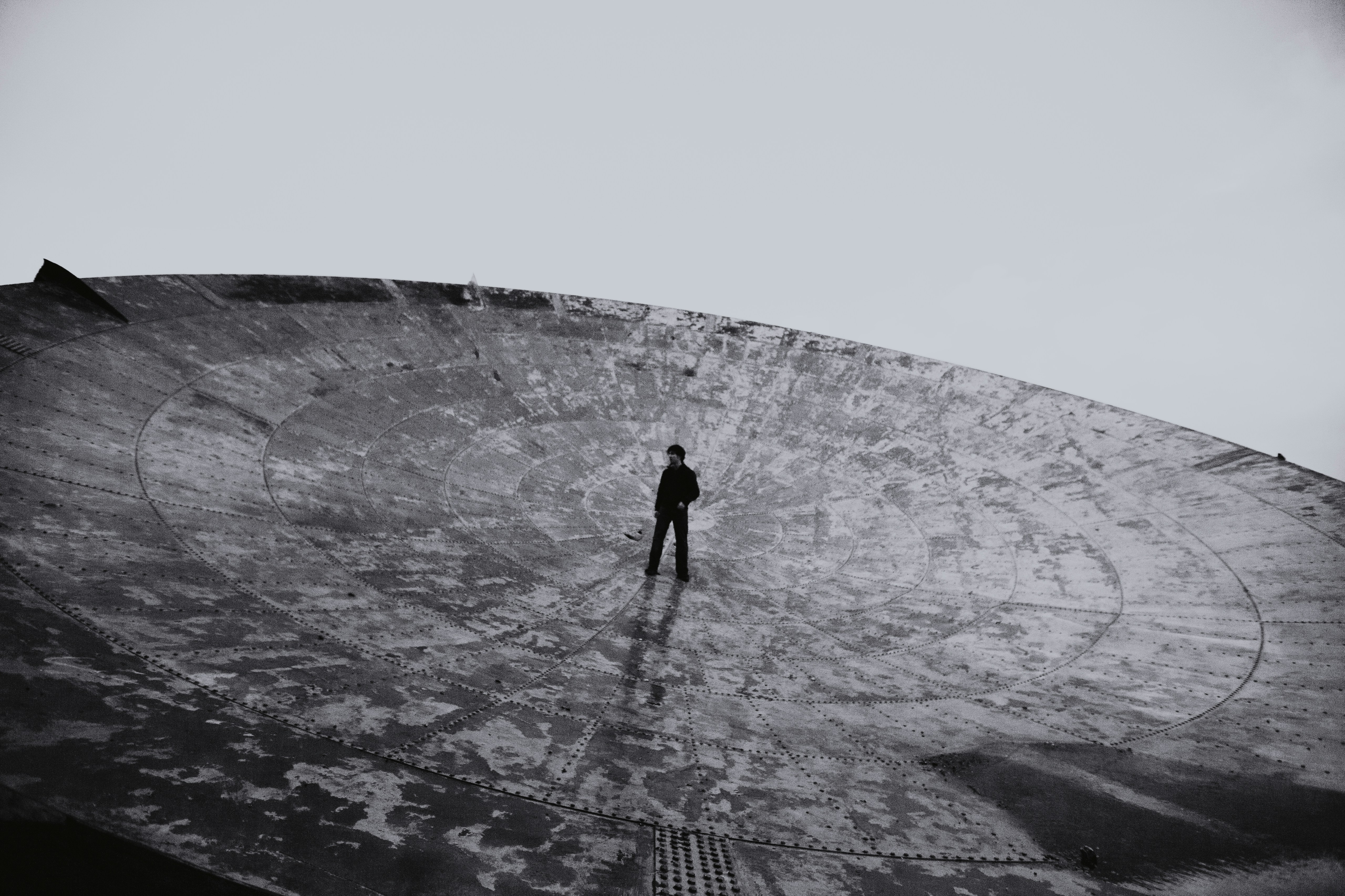 Lone Figure on a Weathered Circular Arena
