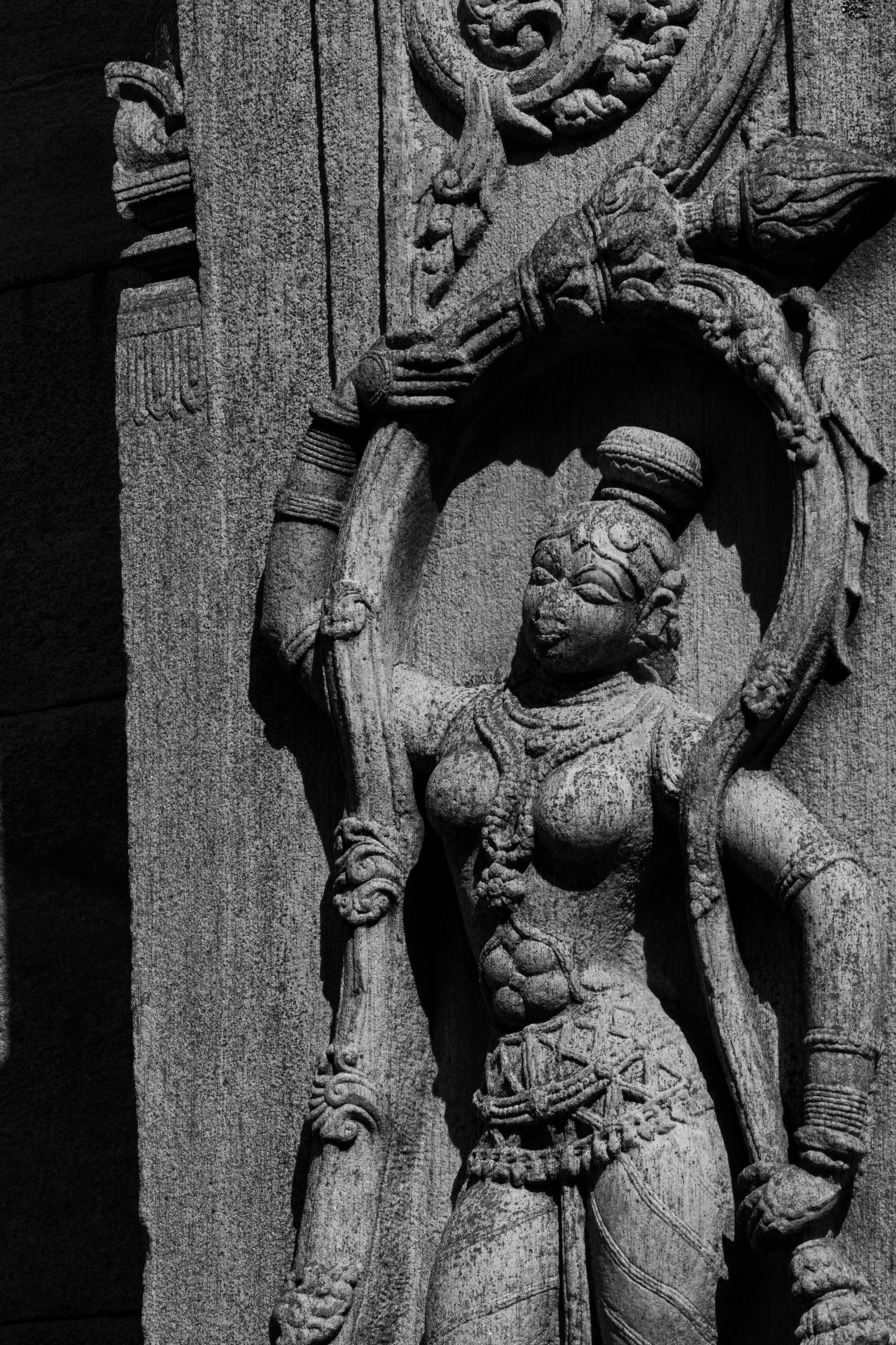 Stone Warrior Aria: A Carved Silhouette in Shadowed Relief