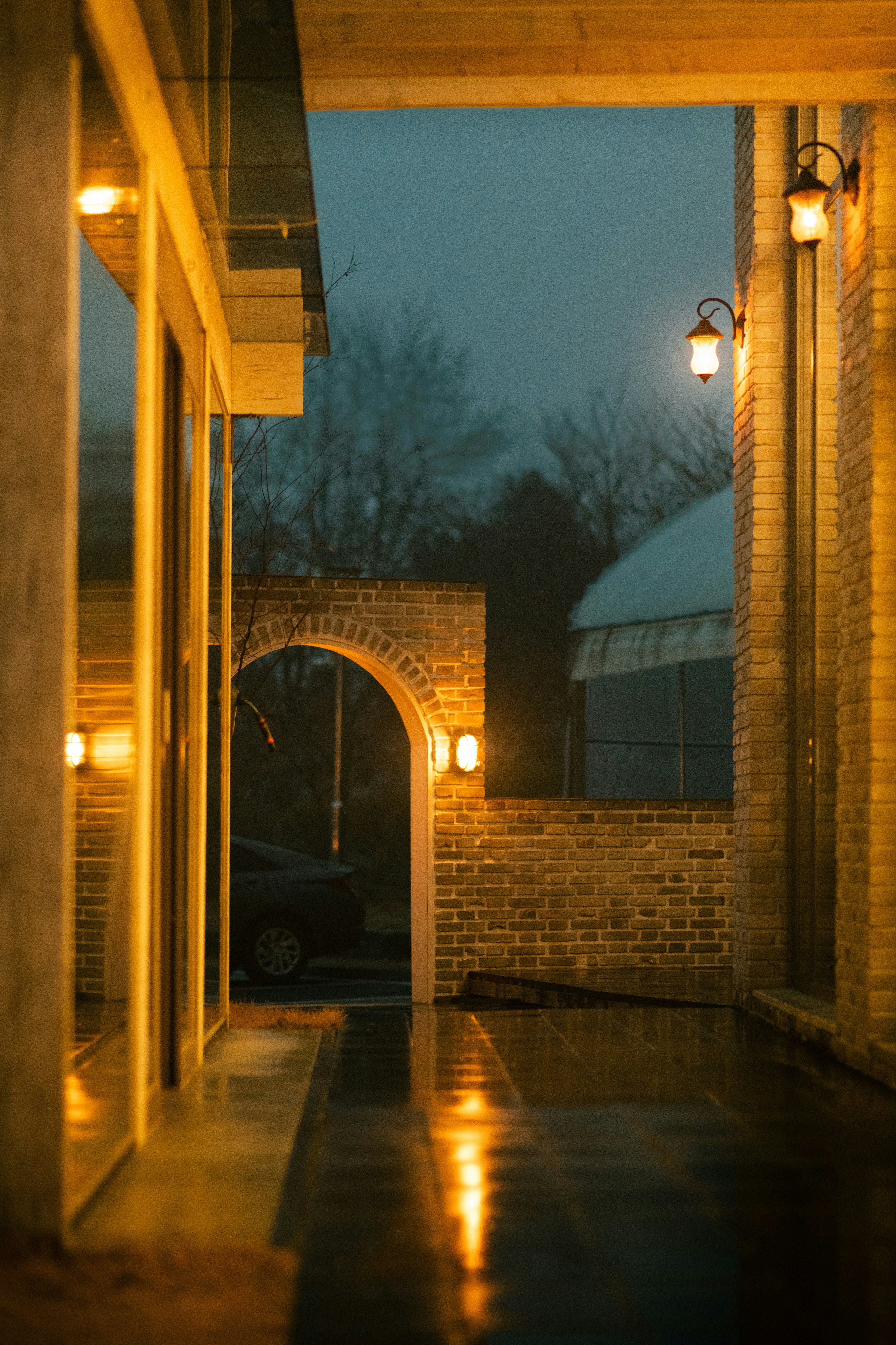 Warm Lanterns and Archway Under Evening Sky