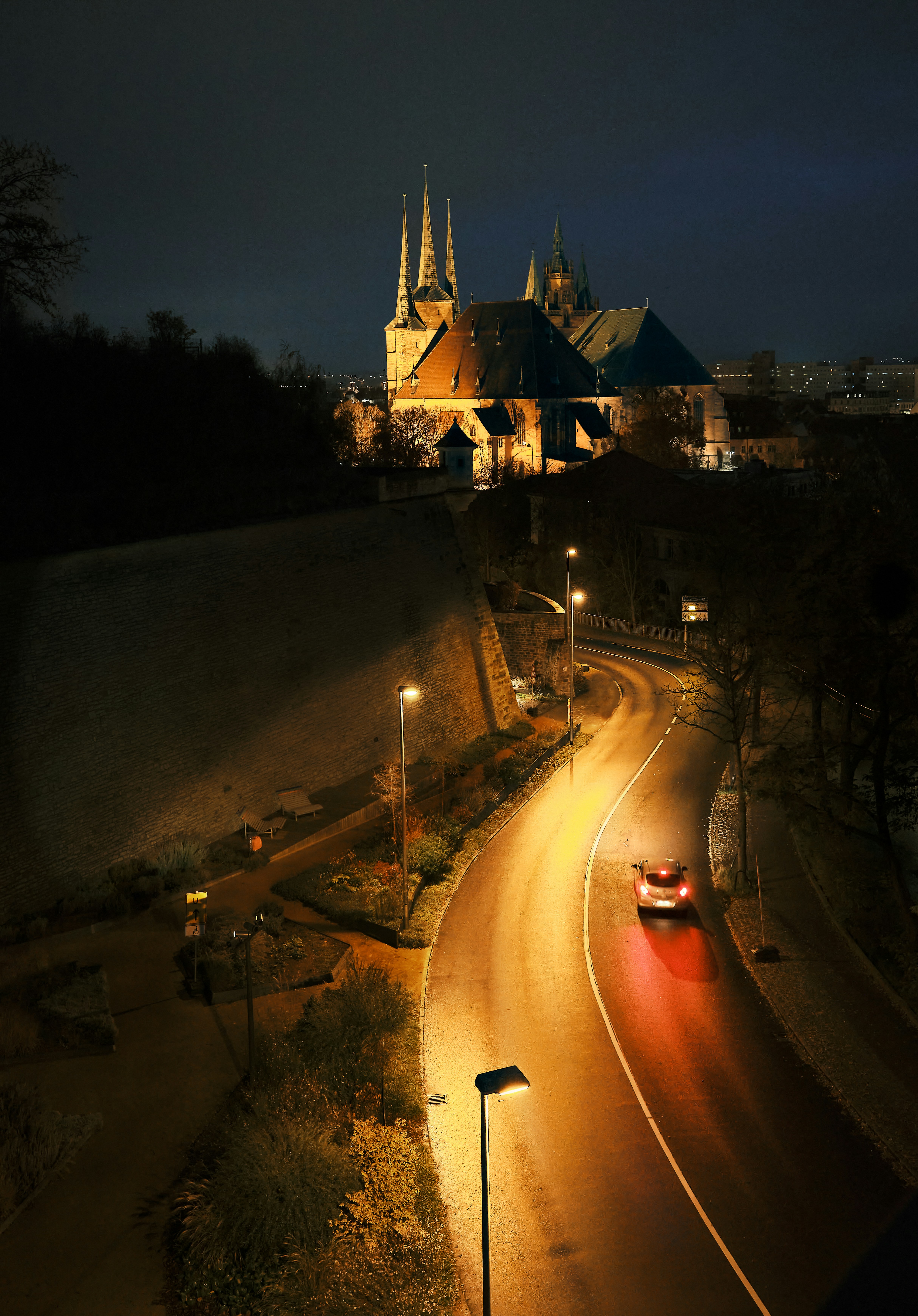 Cobbled Night Ascent: Lanterns Guiding a Quiet City Cathedral