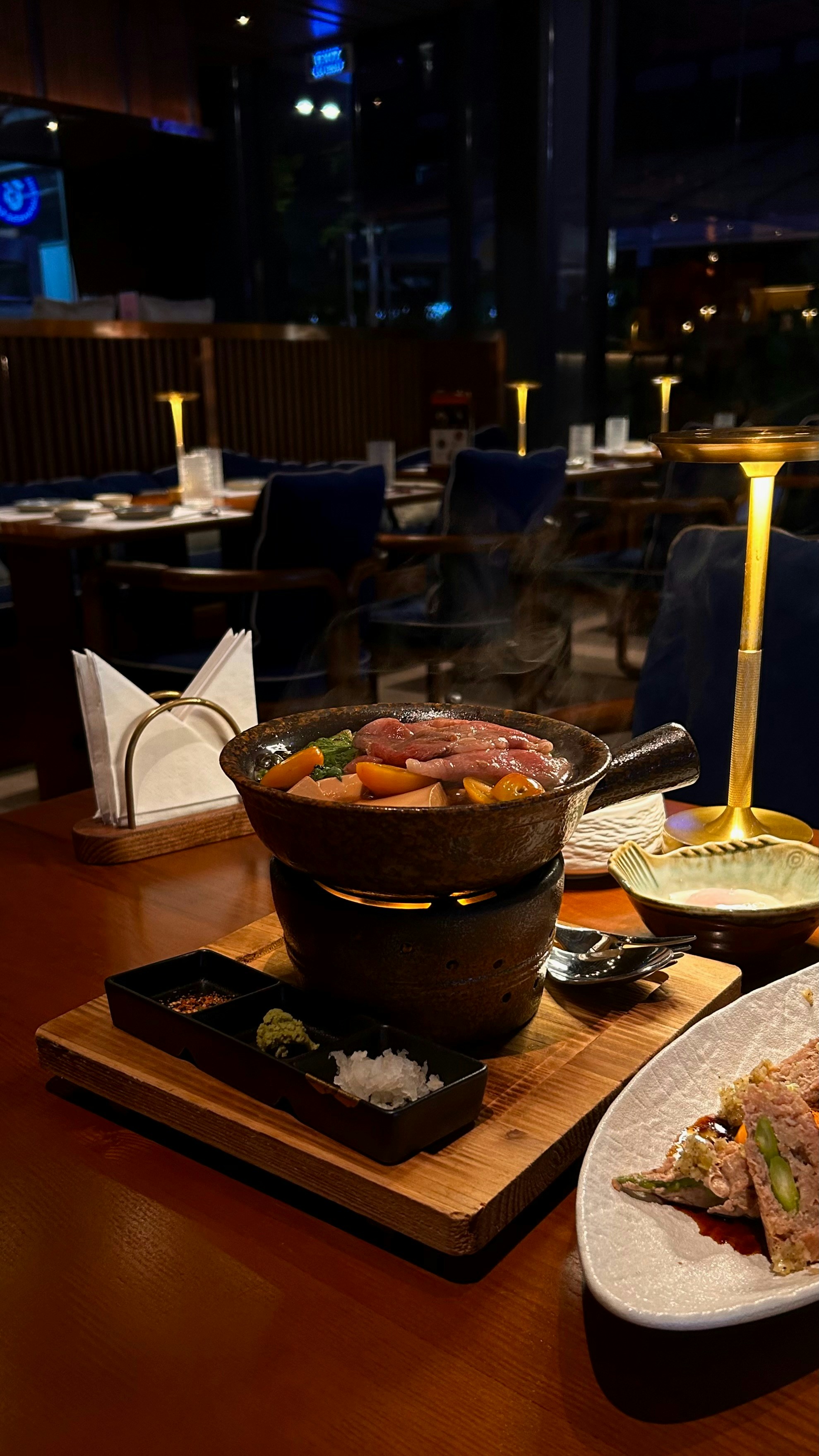 Sizzling Teak Bowl at a Dimly lit Modern Bistro