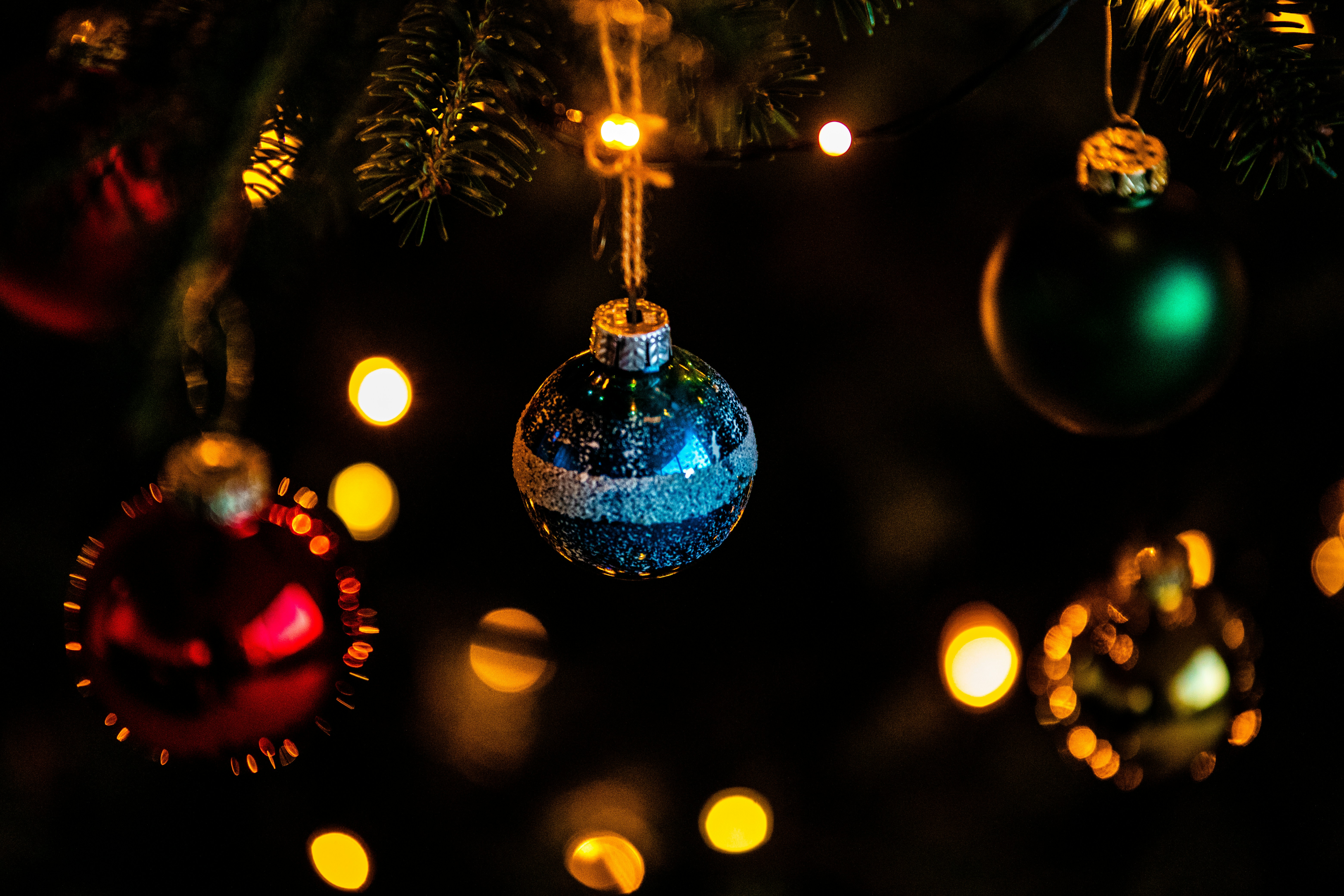 Blue ornament in warm holiday glow