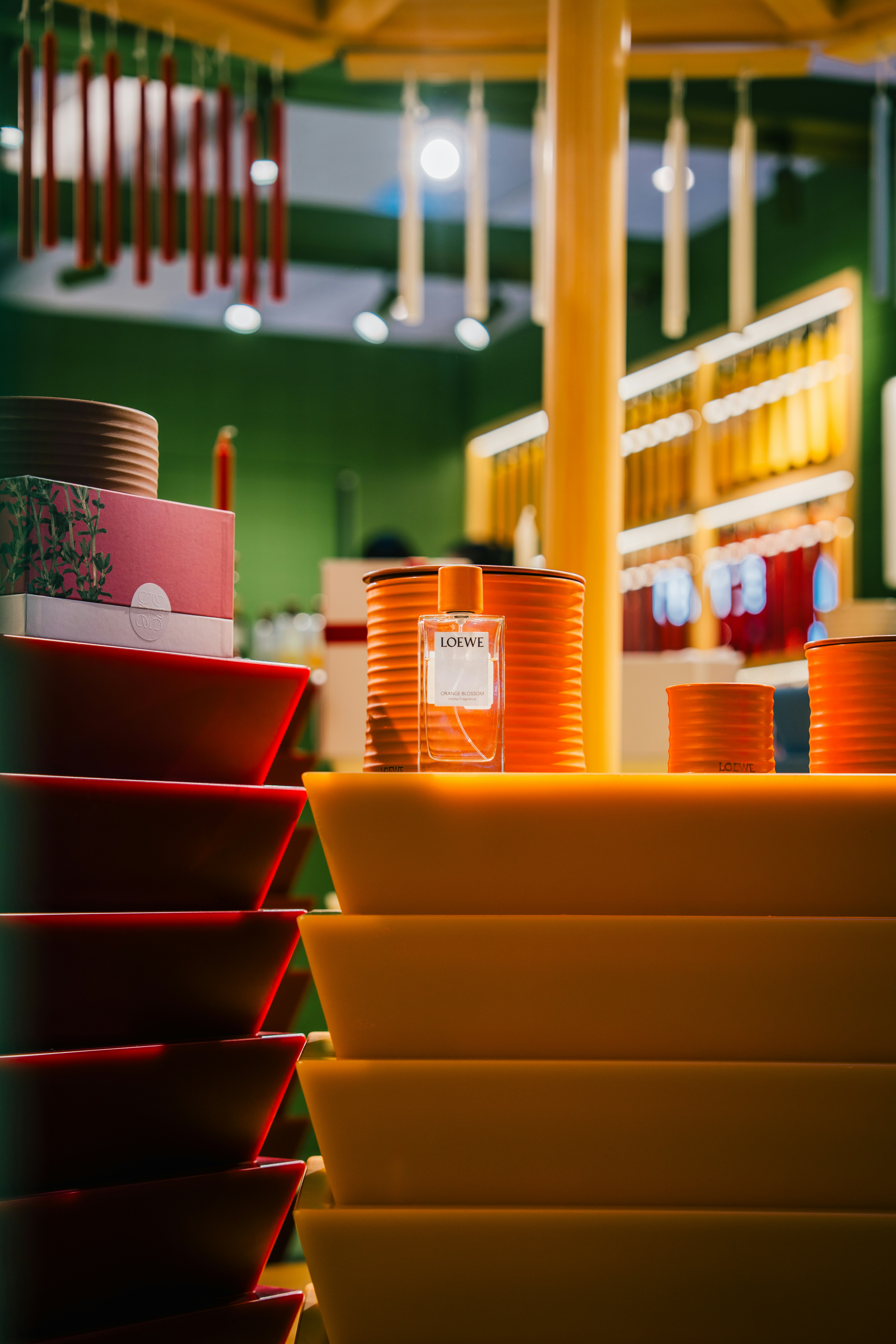 Perfume bottle displayed on stacked orange containers. photo – Free ...