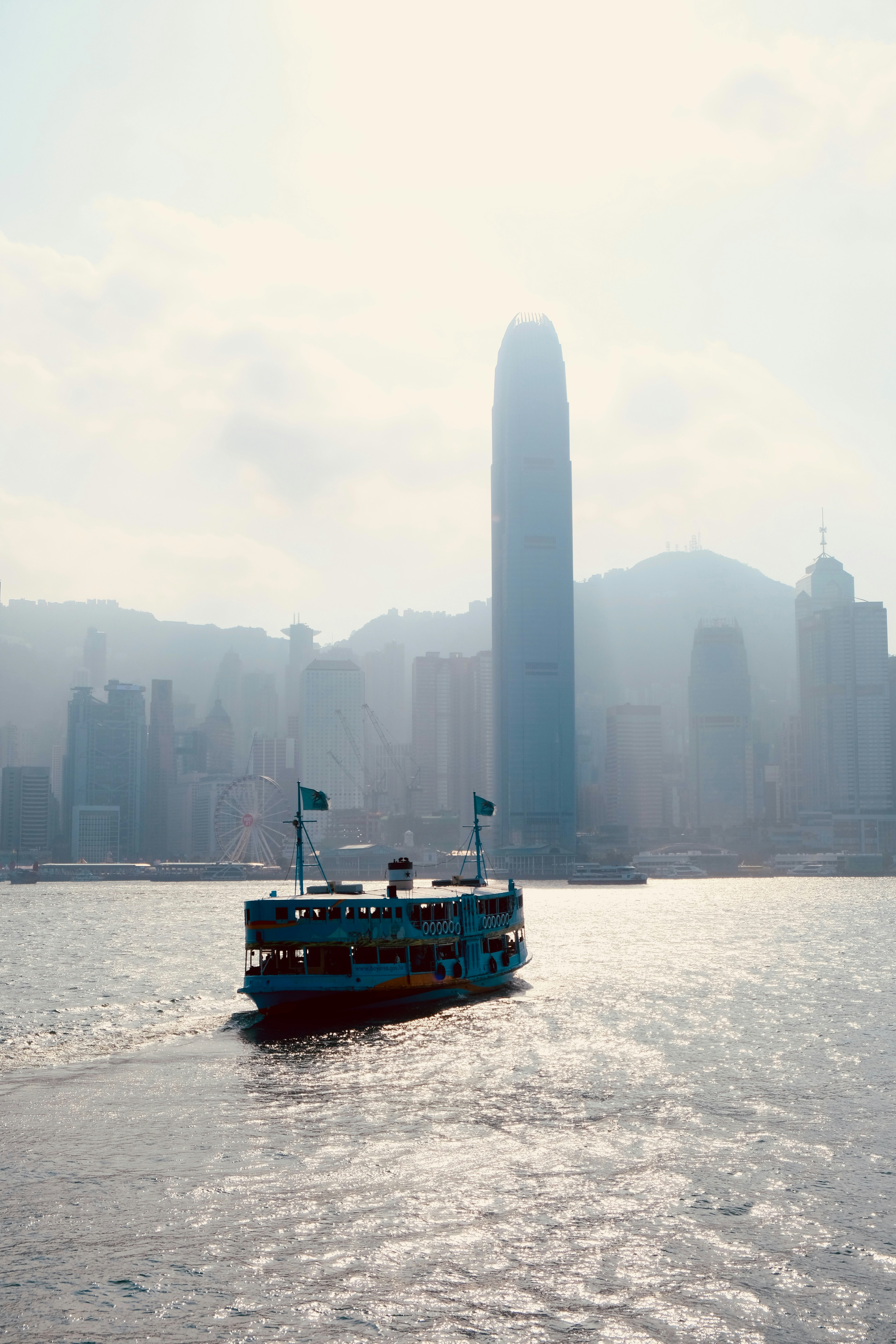 Harbor Ferry against a Misty Skyline
