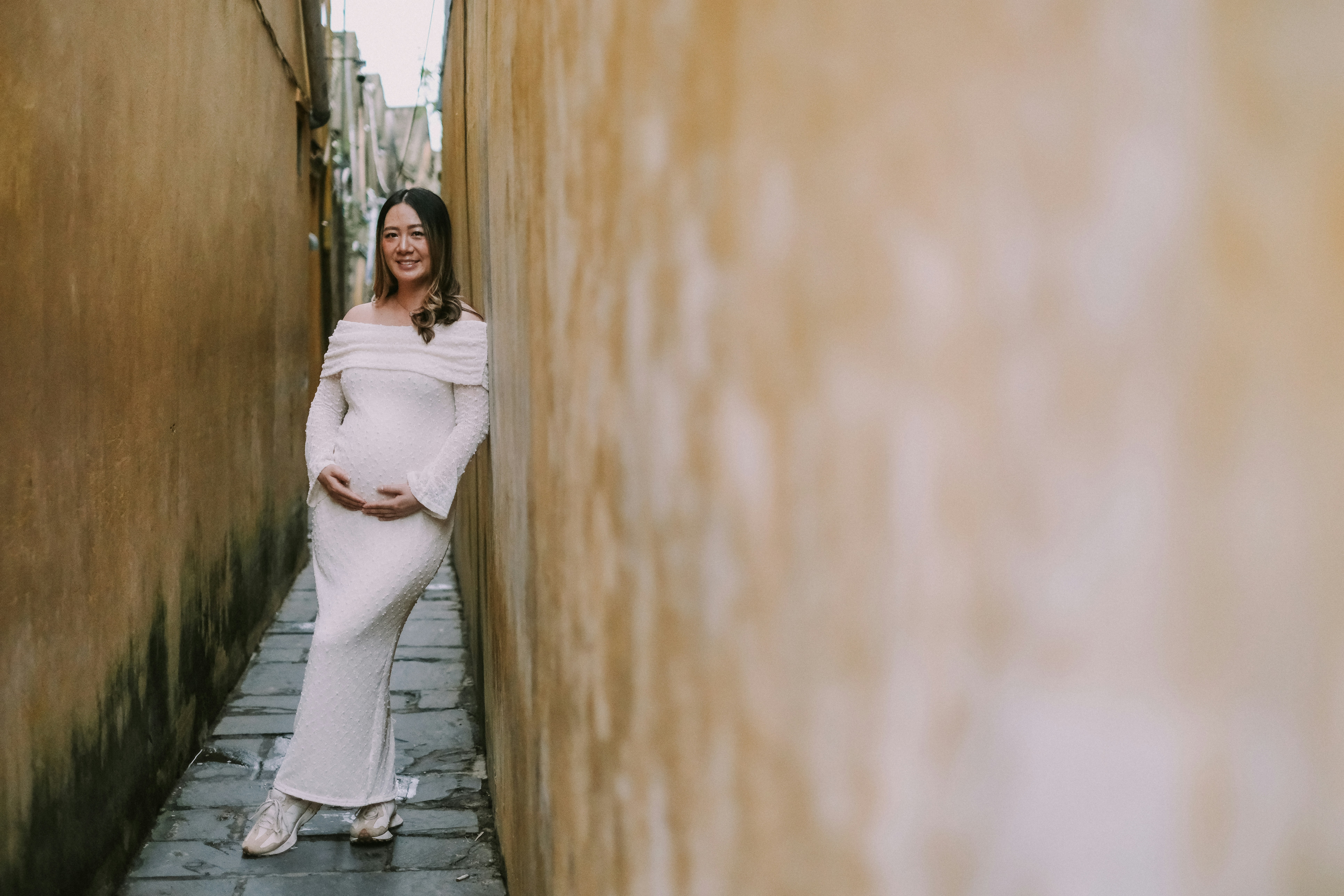 A Narrow Path to Calm: Portrait in a Sunlit Corridor