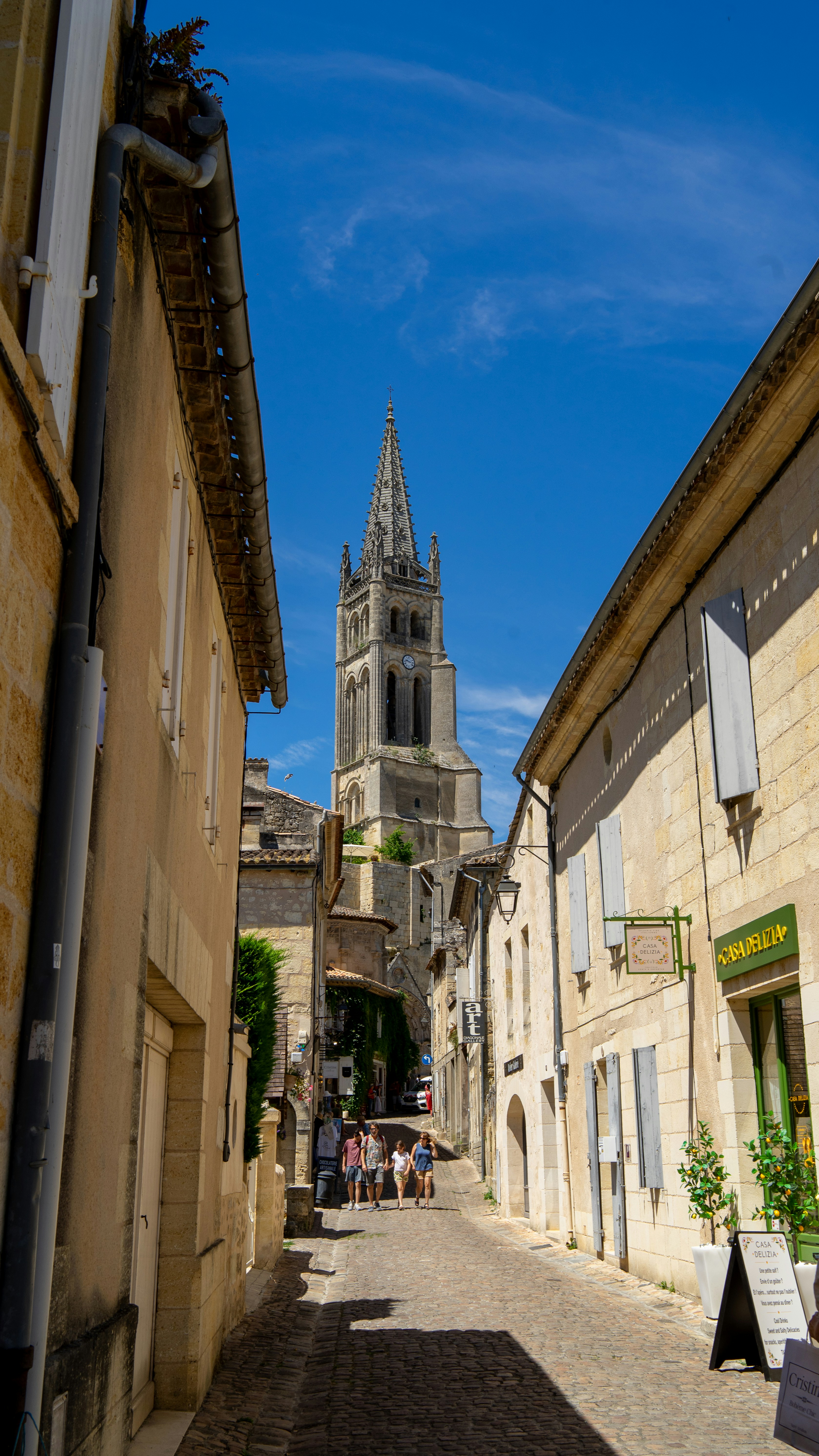 Staircase to the Spire: A Sunlit Medieval Alley