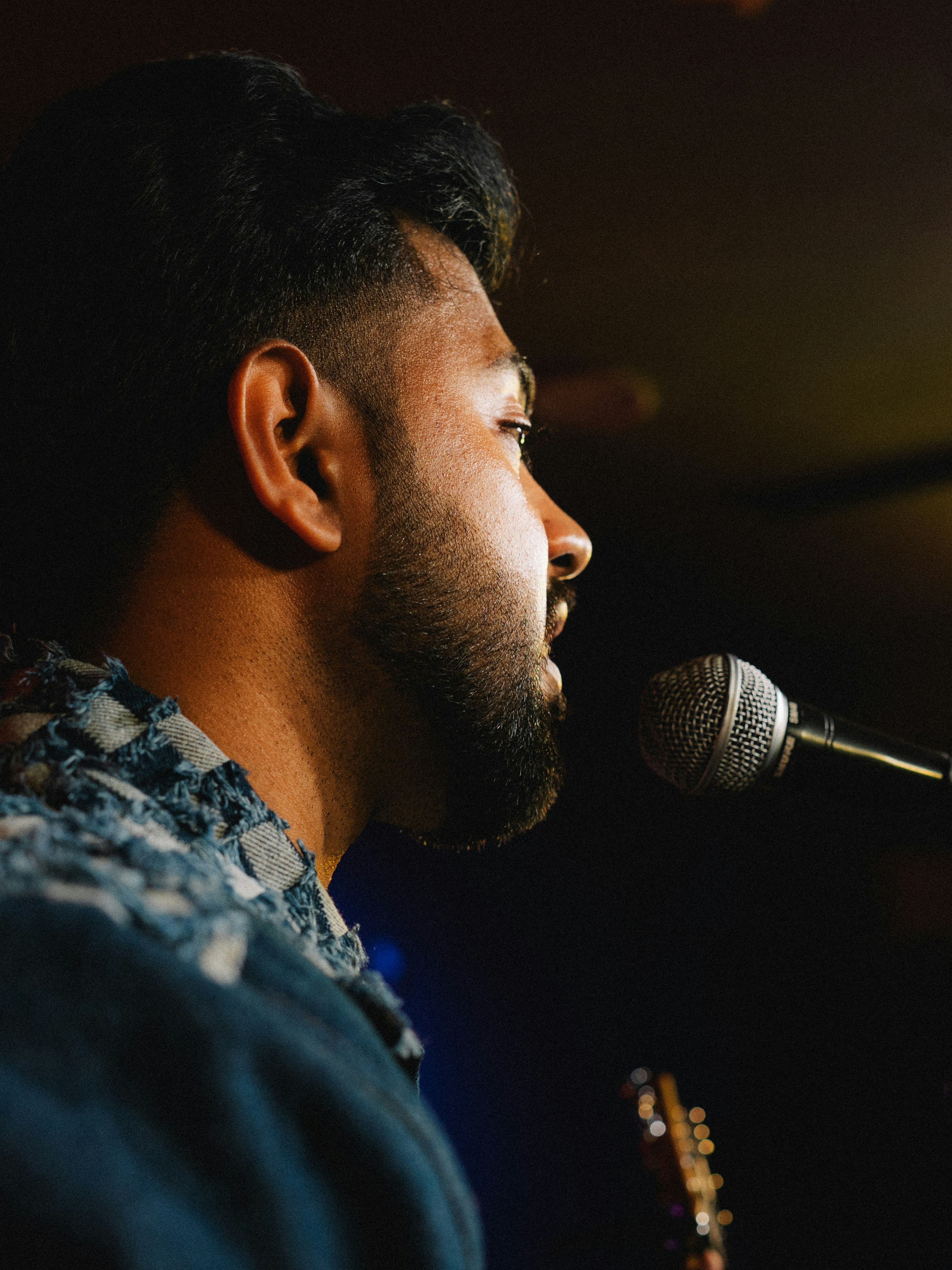 Side Profile Serenade: A Vocal Moment in the Spotlight