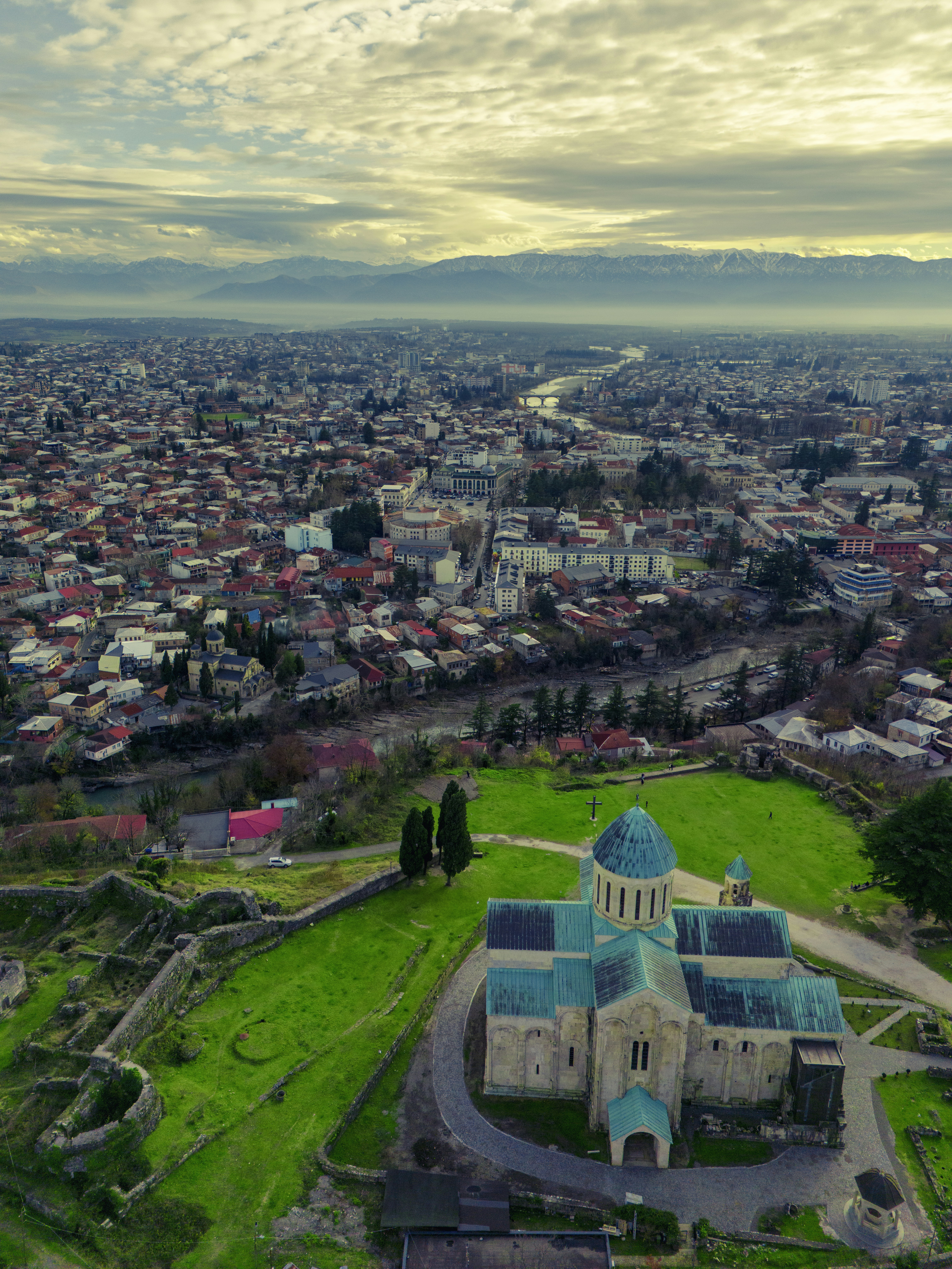 Bagrati Cathedral in Kutaisi, Georgia, is an 11th-century Georgian Orthodox church. Known for its cross-dome design and stone architecture, it sits atop a hill overlooking the city. Partially ruined, it has been restored and is a UNESCO World Heritage site, symbolizing Georgia’s Christian heritage.ALEKO KEZEVADZE