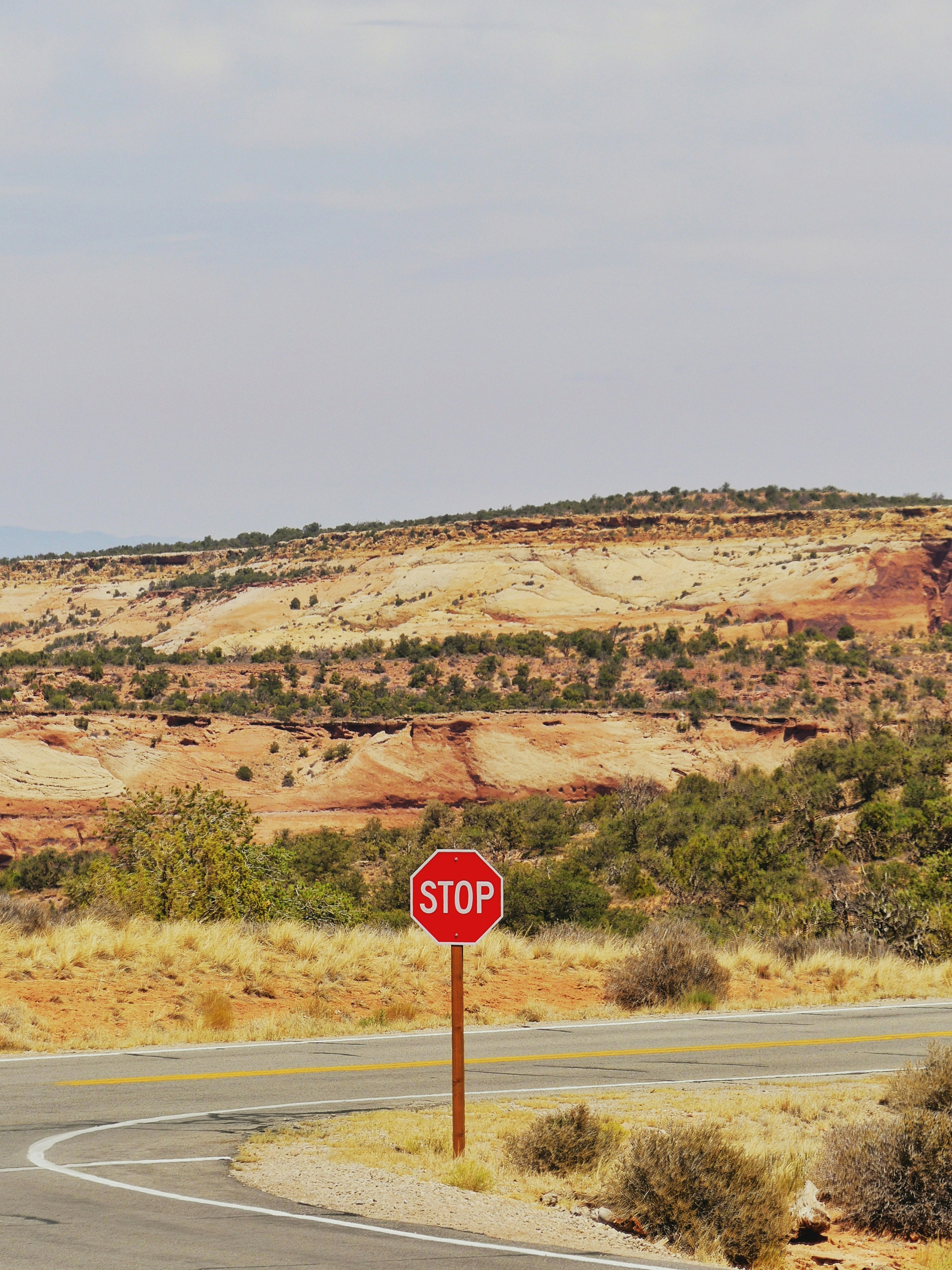 Desert Road at the Hanging Hills: A Stop Sign in the Distant Landscape