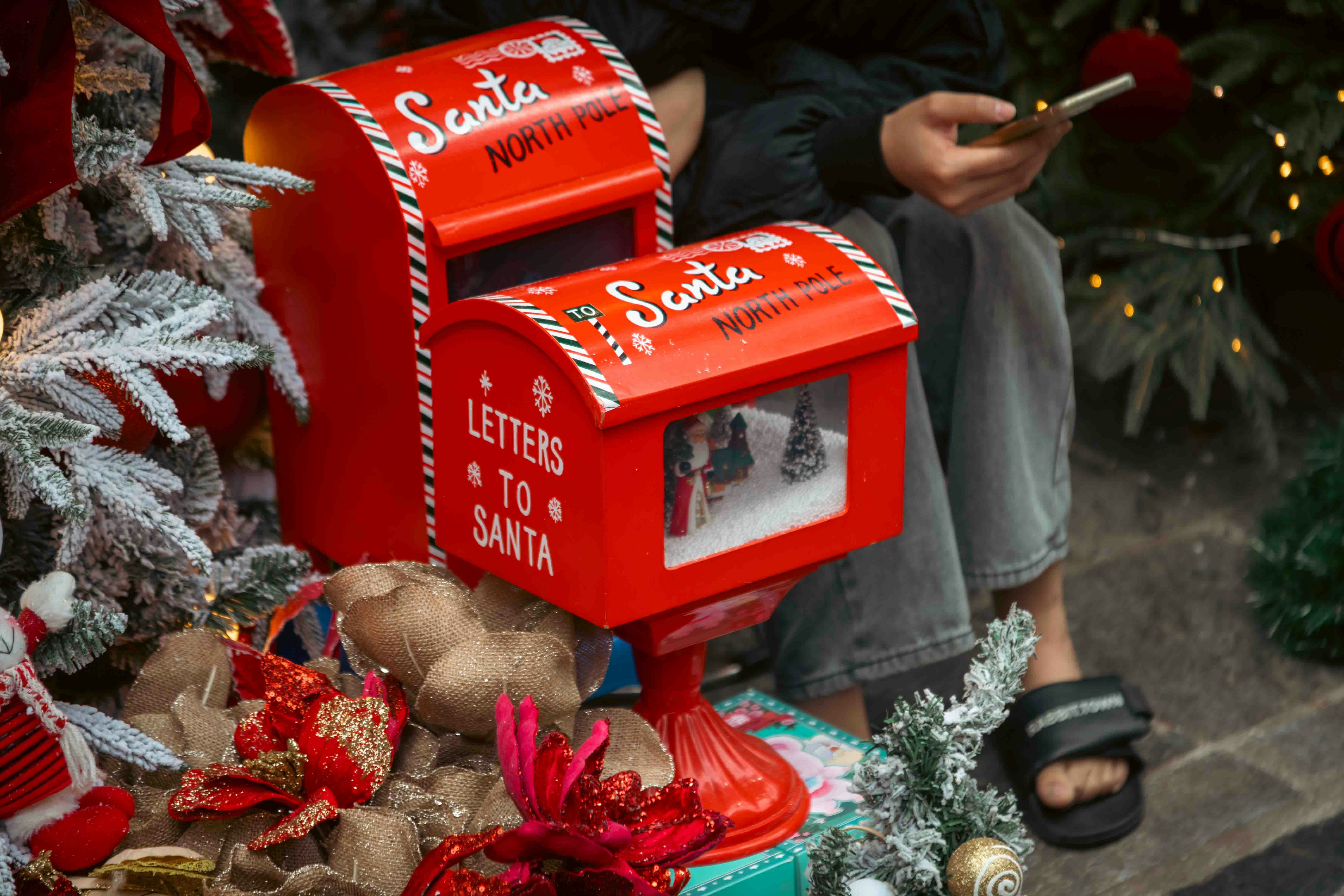 Red Santa Mailbox Amid Holiday Embellishments