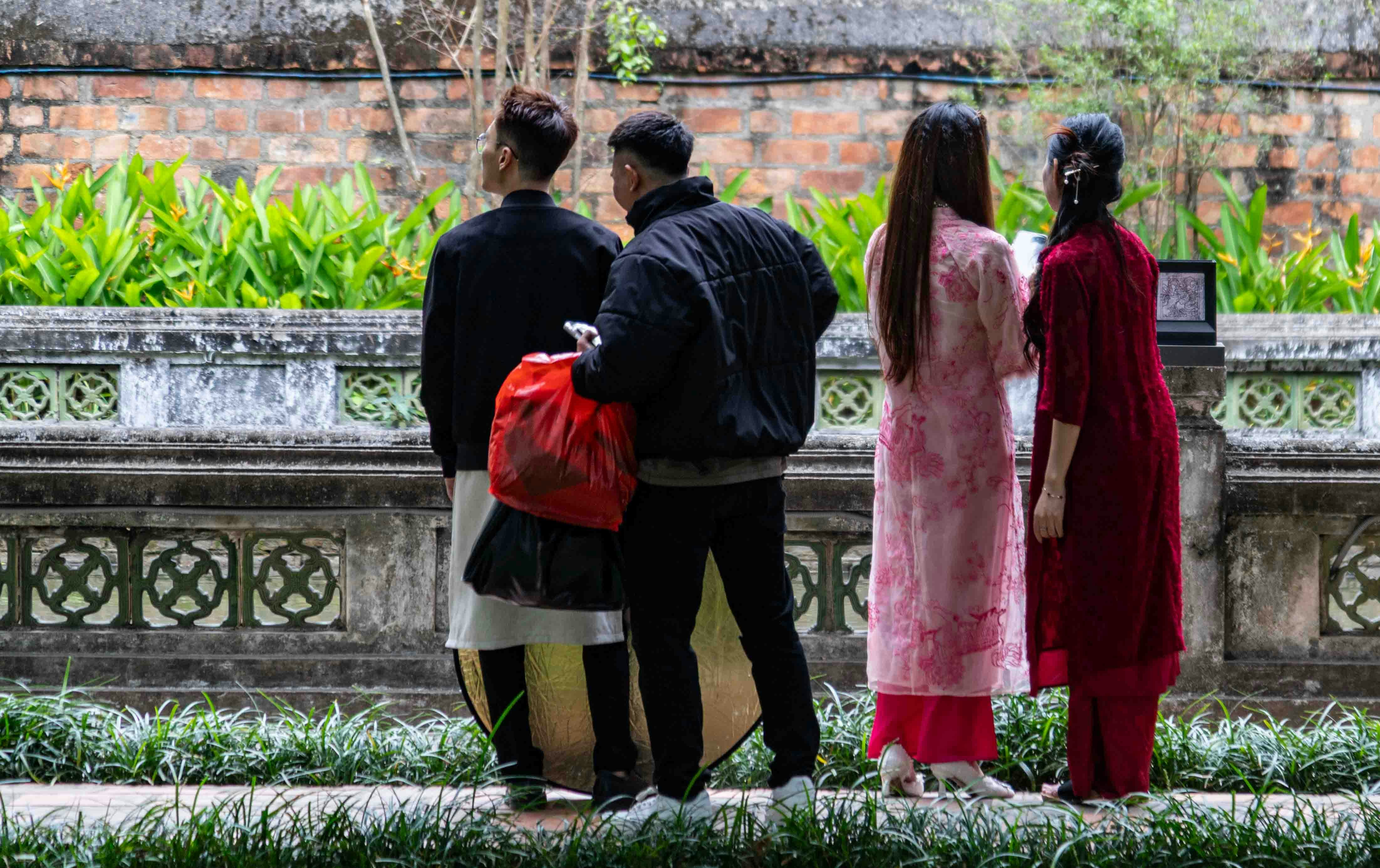 Shared Moment by the Garden Wall