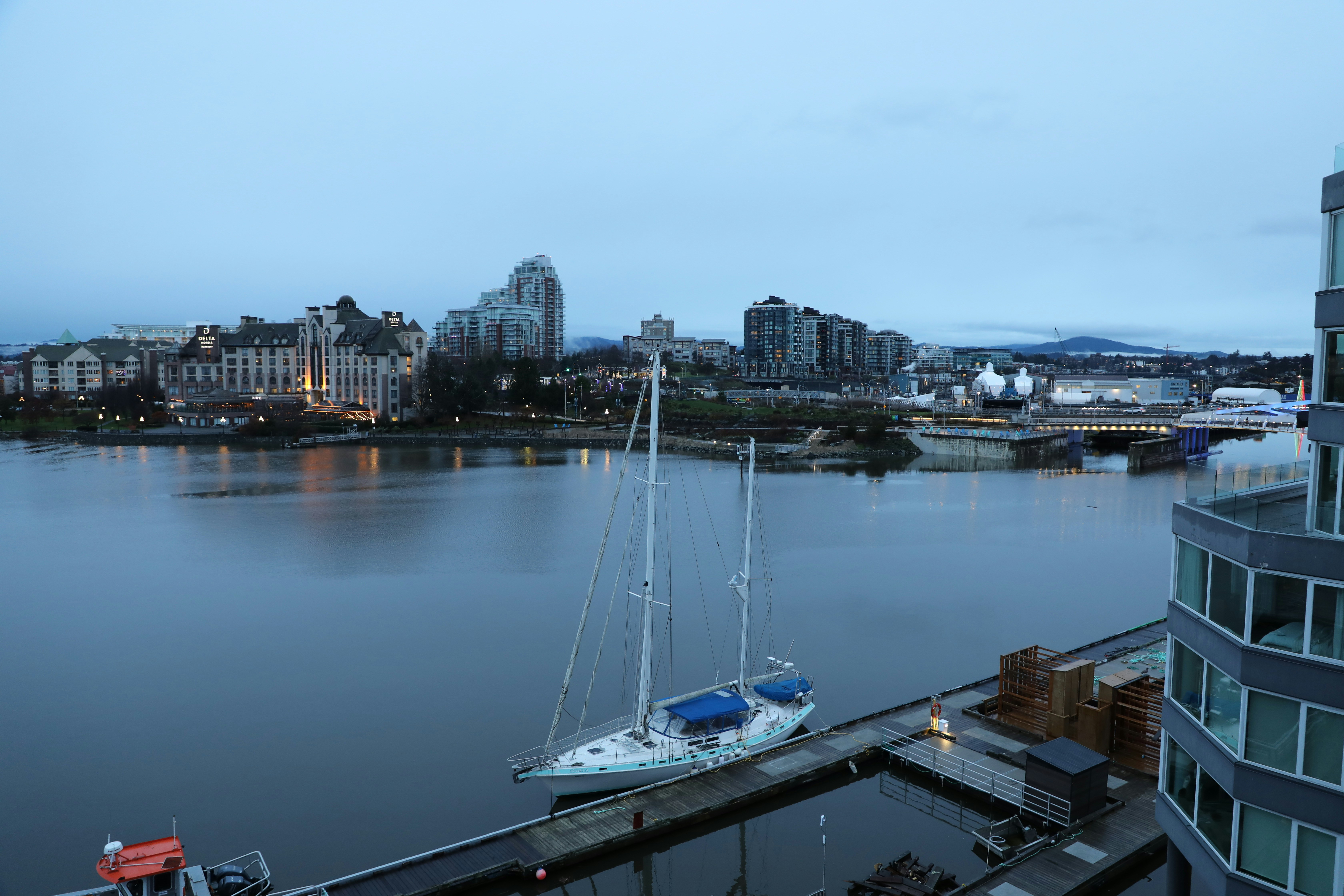 Harbor Calm: Sails at Dusk by the Waterfront