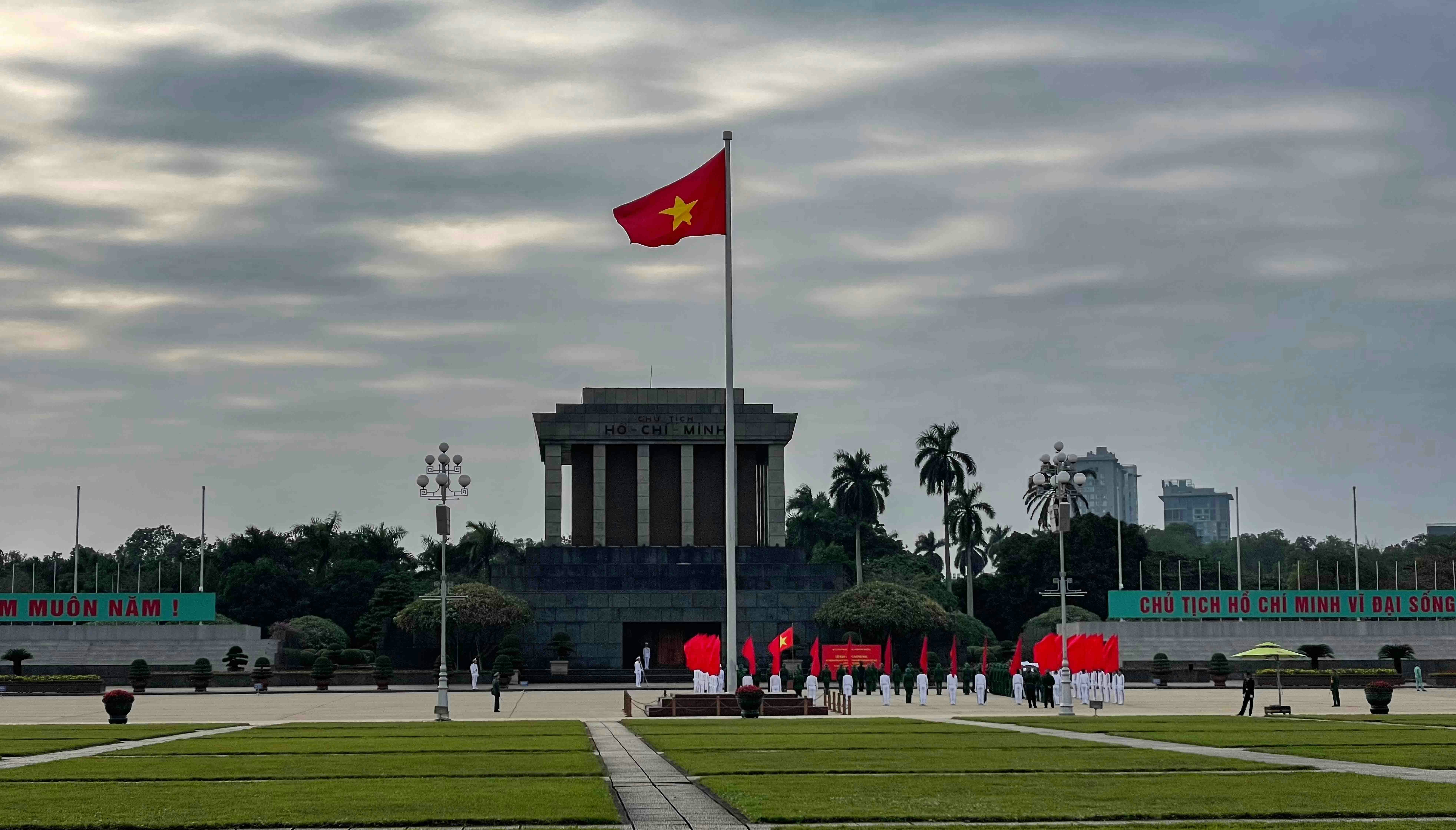 Flag Over the Memorial: Sunset at a Vietnamese Square