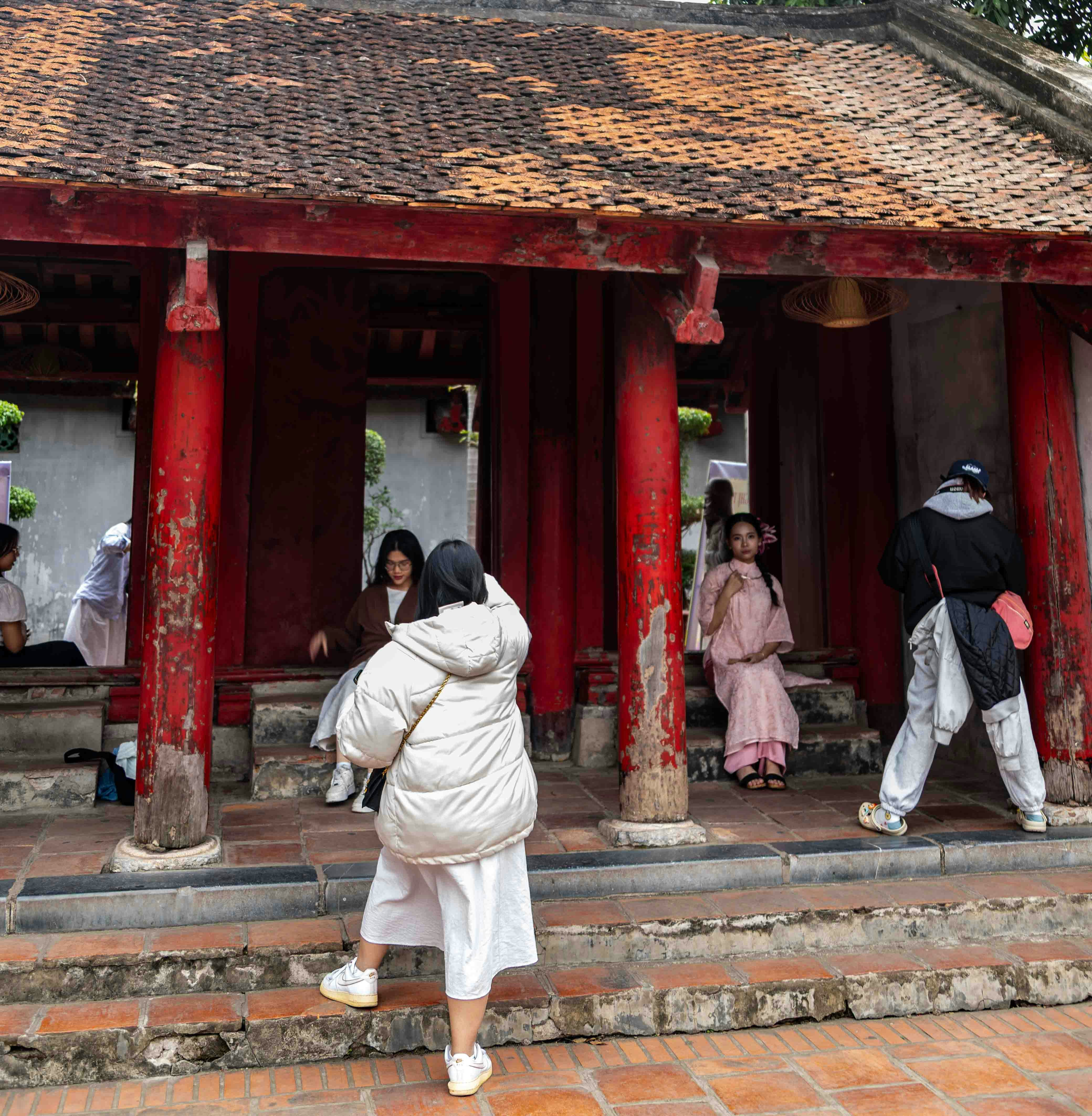 Red Timbered Gallery: A Quiet Moment Under the Temple Roof