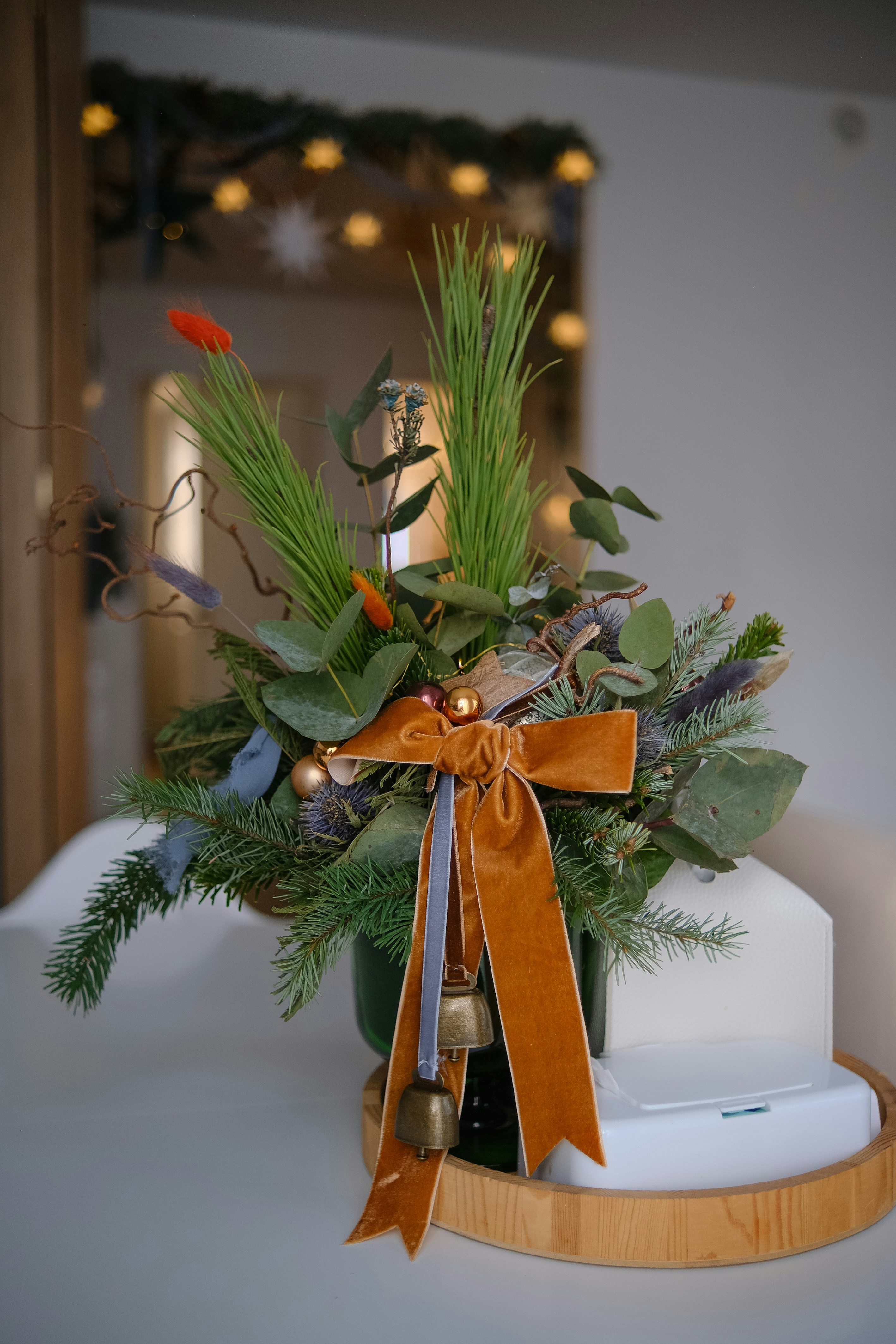 Verdant Holiday Centerpiece with Orange Ribbon