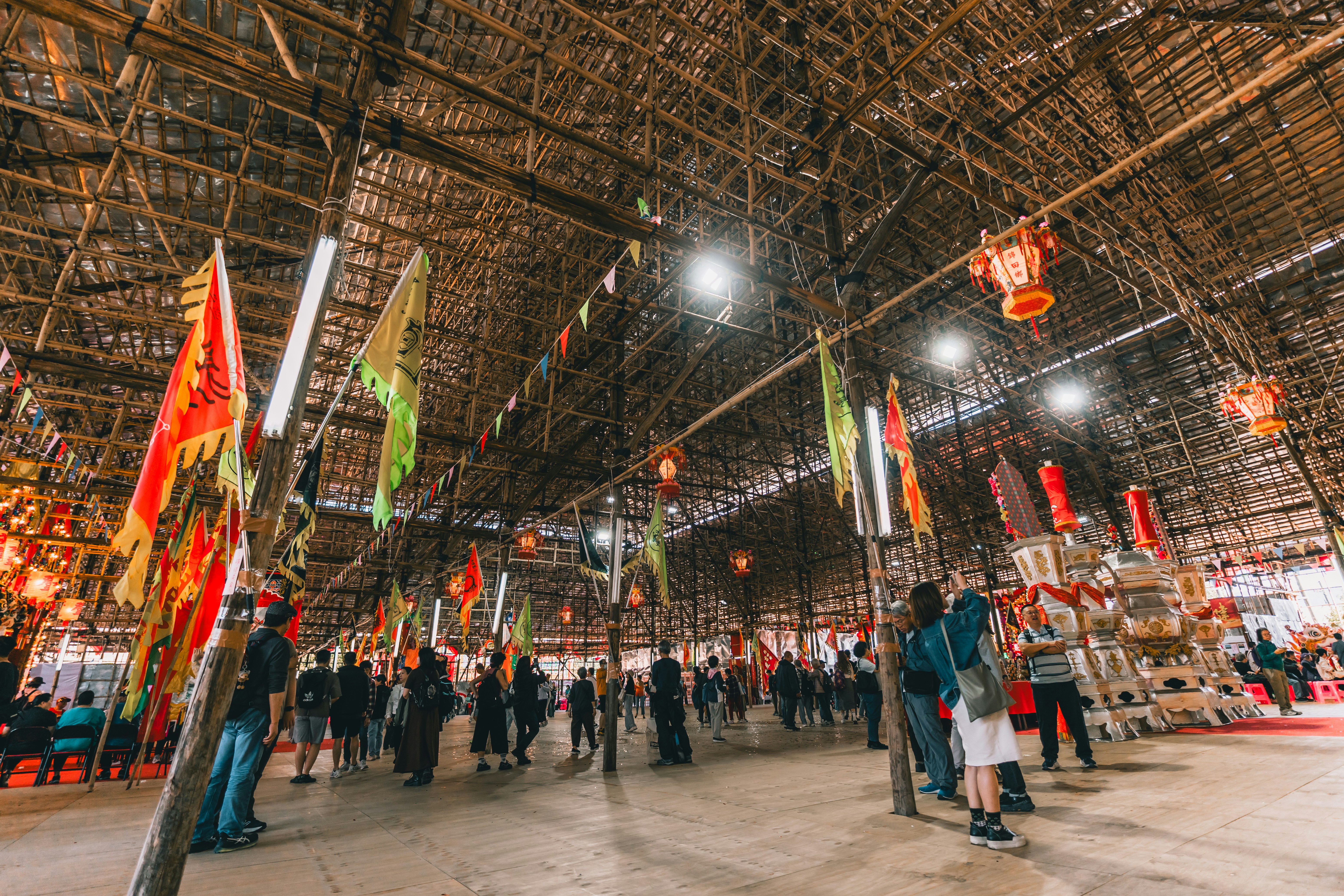 Lantern-lit Curiosity: A Crowded Market Hall of Color and Woven Traditions