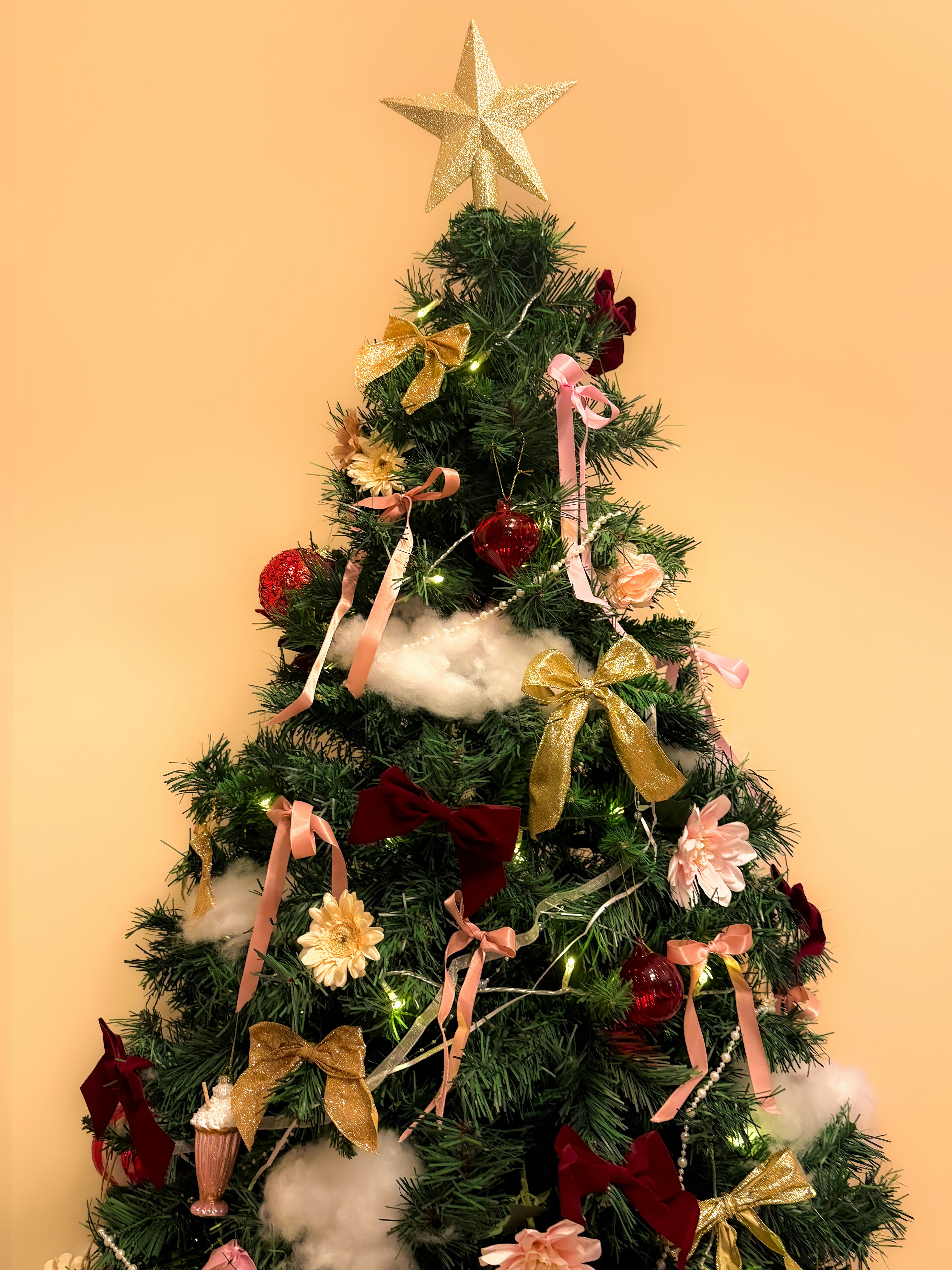 Golden Star atop a Ribbon-Wrapped Christmas Tree