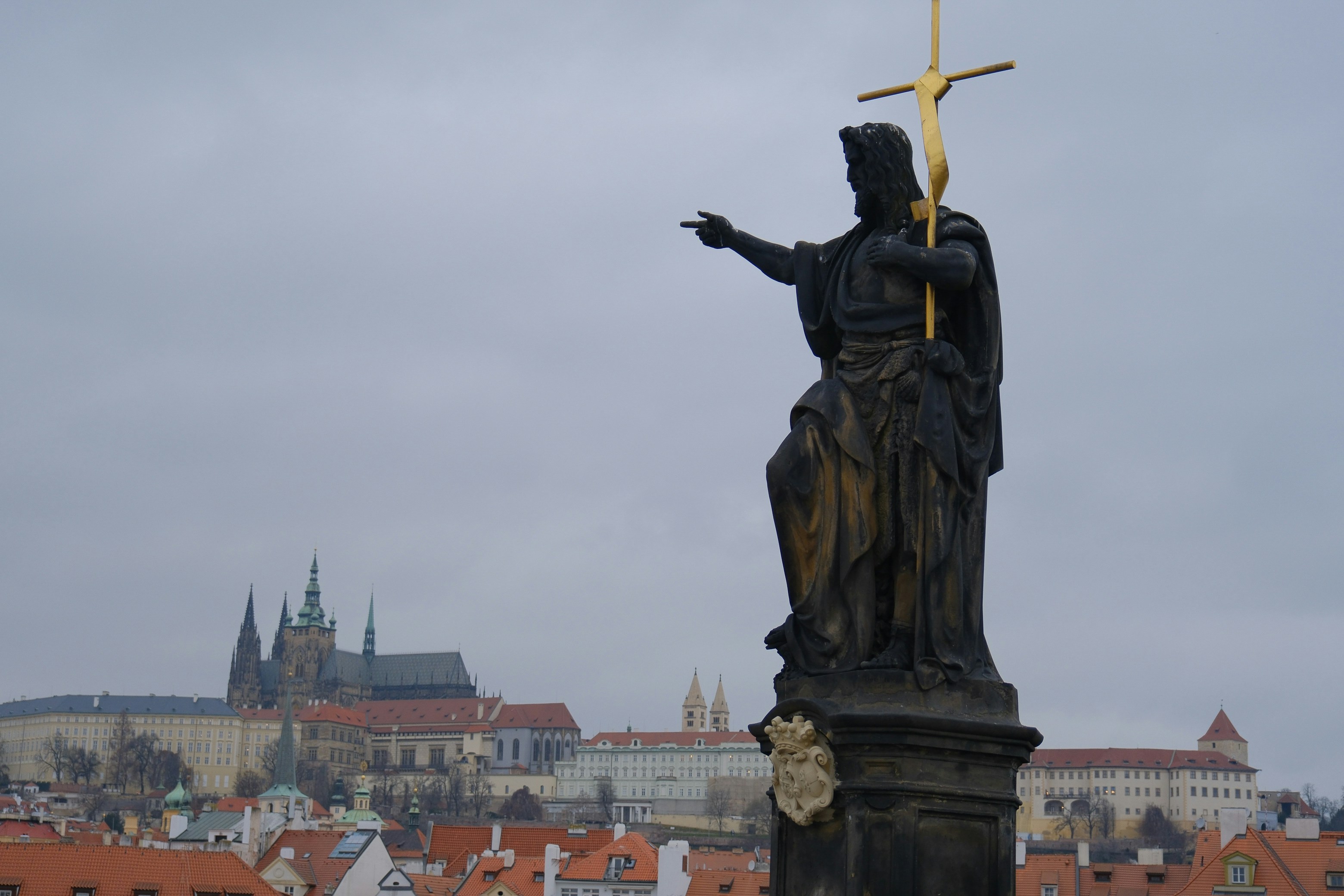 Statue Sentinel Over Prague: A Prominent Figure Overlooking the City
