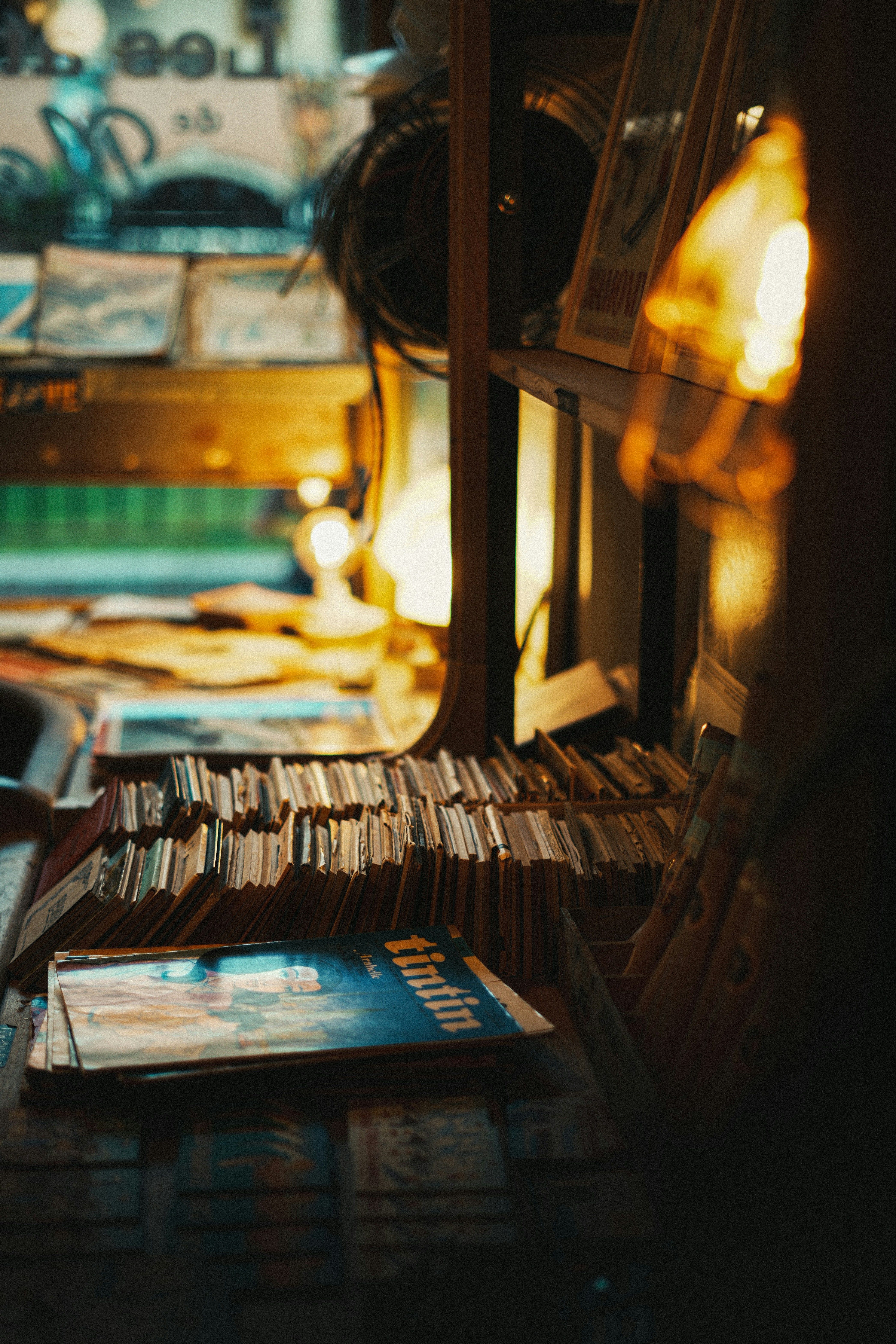 Dusty Magazine Stacks in a Dimly Lit Bookshop