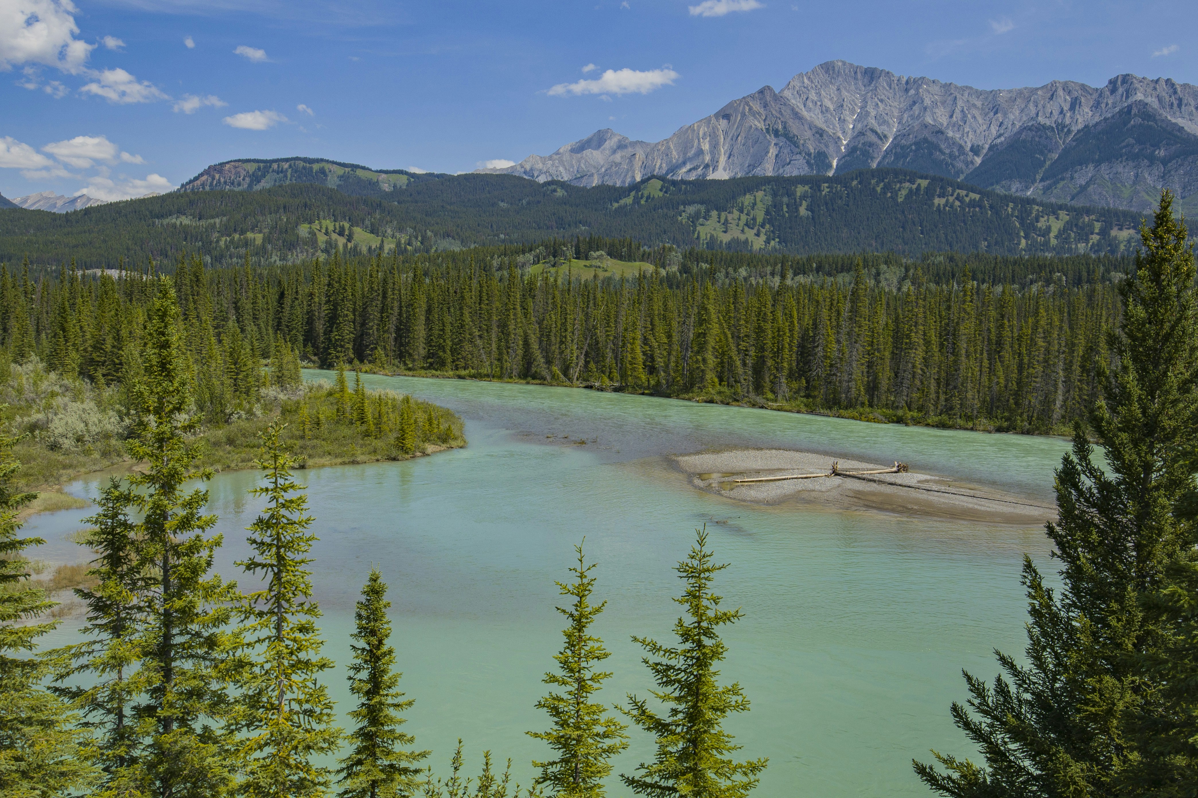 Emerald River Bend Under Alpine Peaks