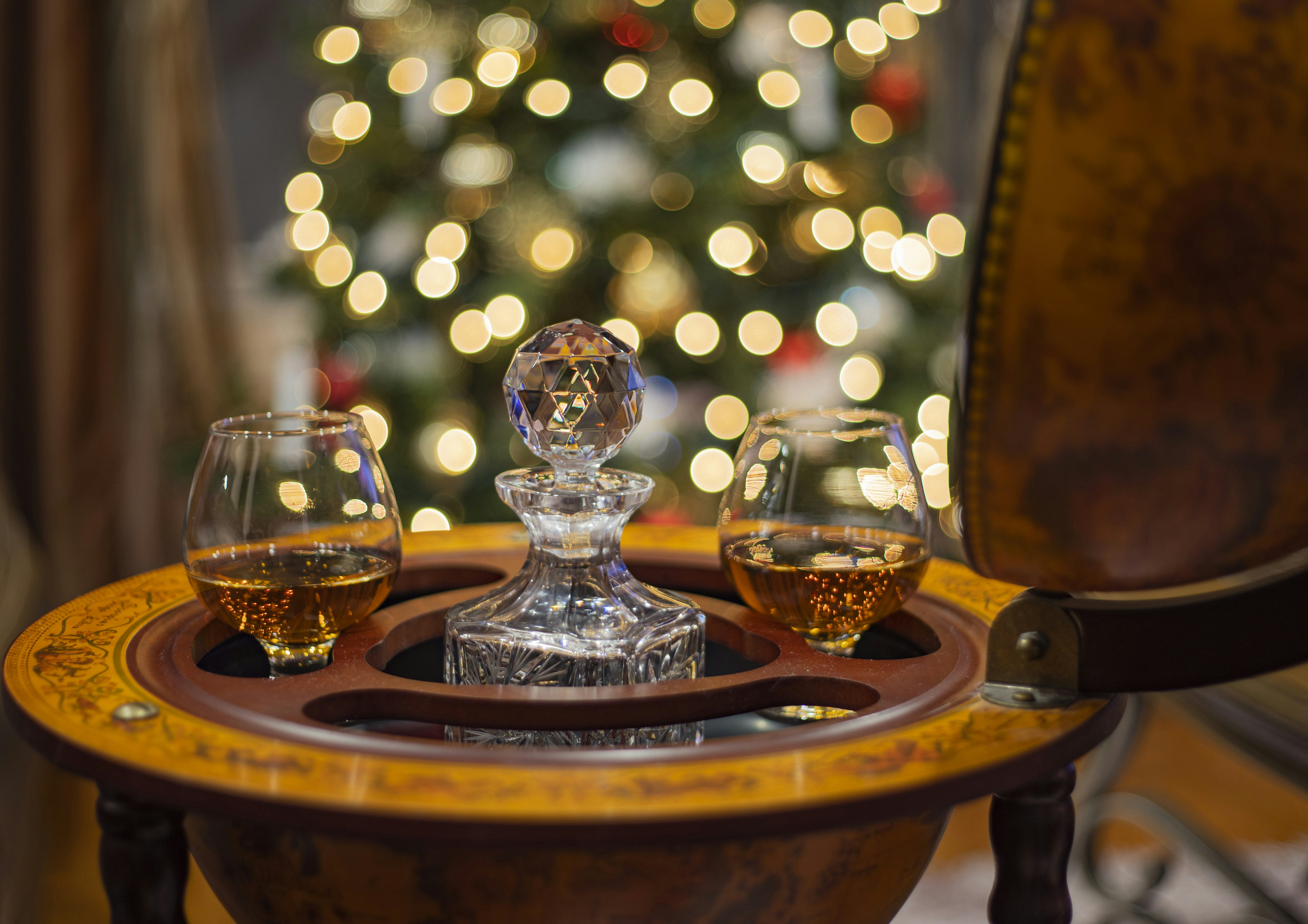 Crystal Stopover: A Festive Glass Reflections on a Carved Waldron Table