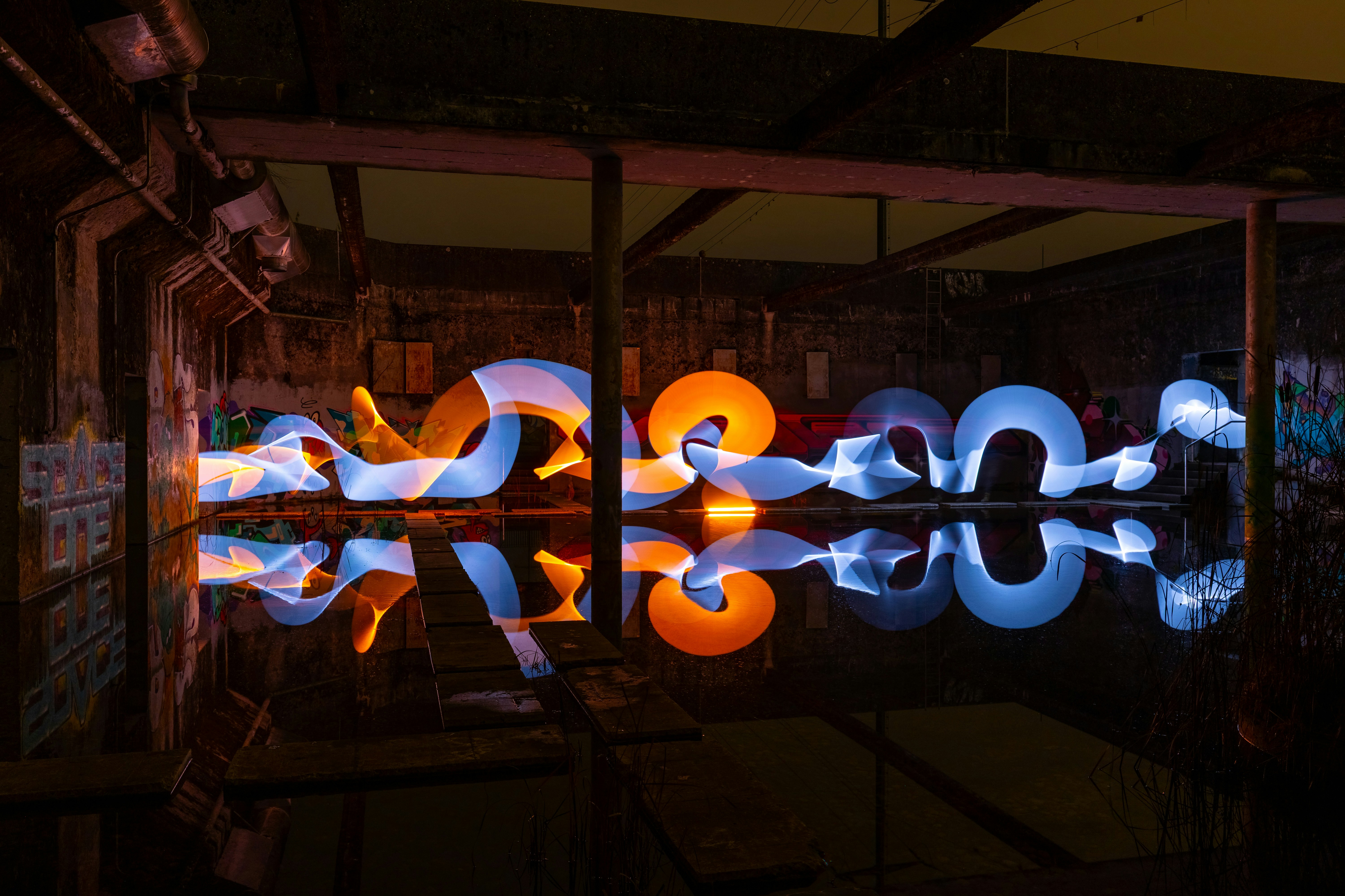 Chromatic Flame Reflections in a Dim Industrial Pool