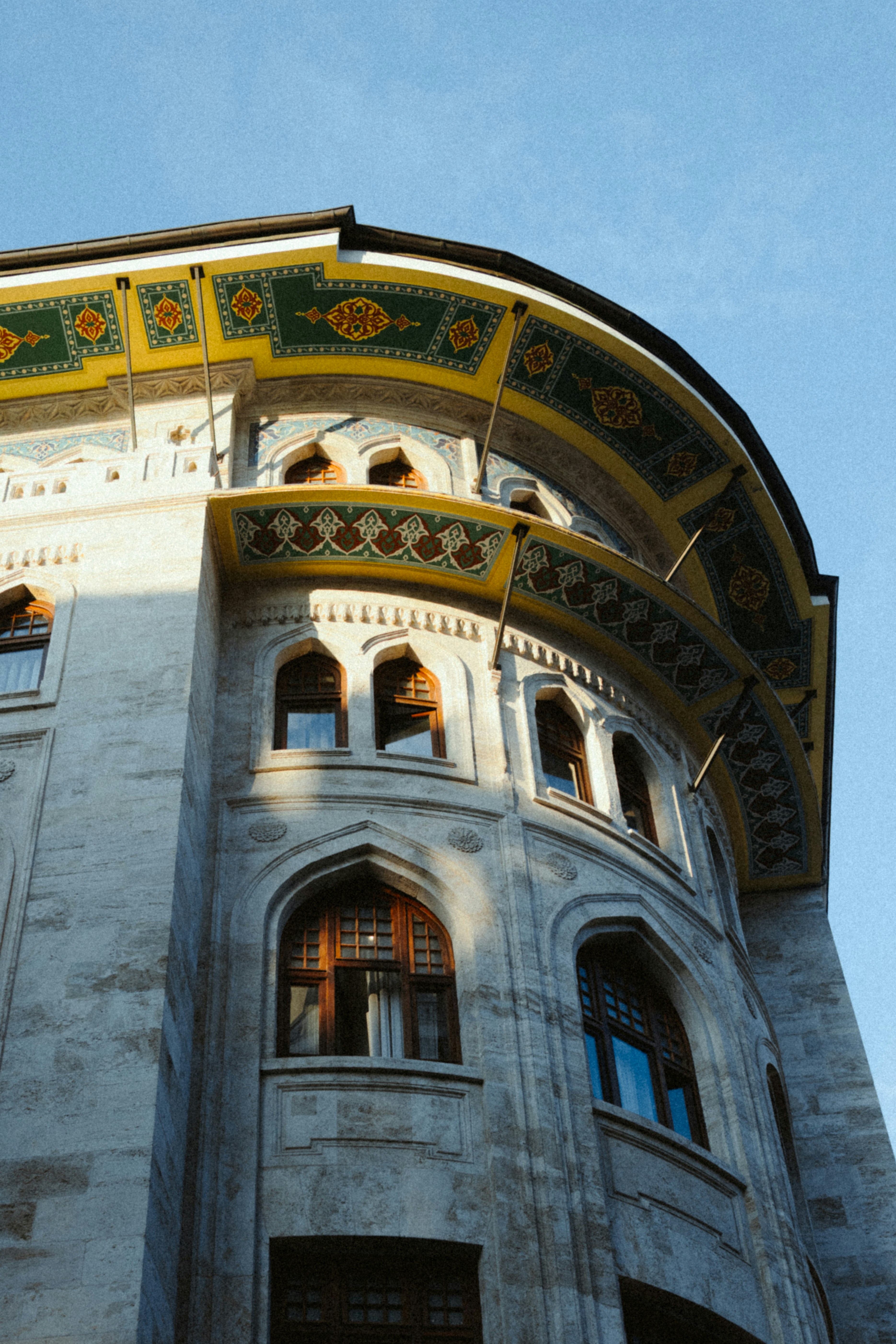 Ornate Corner: A Curved Facade Basks in Evening Light