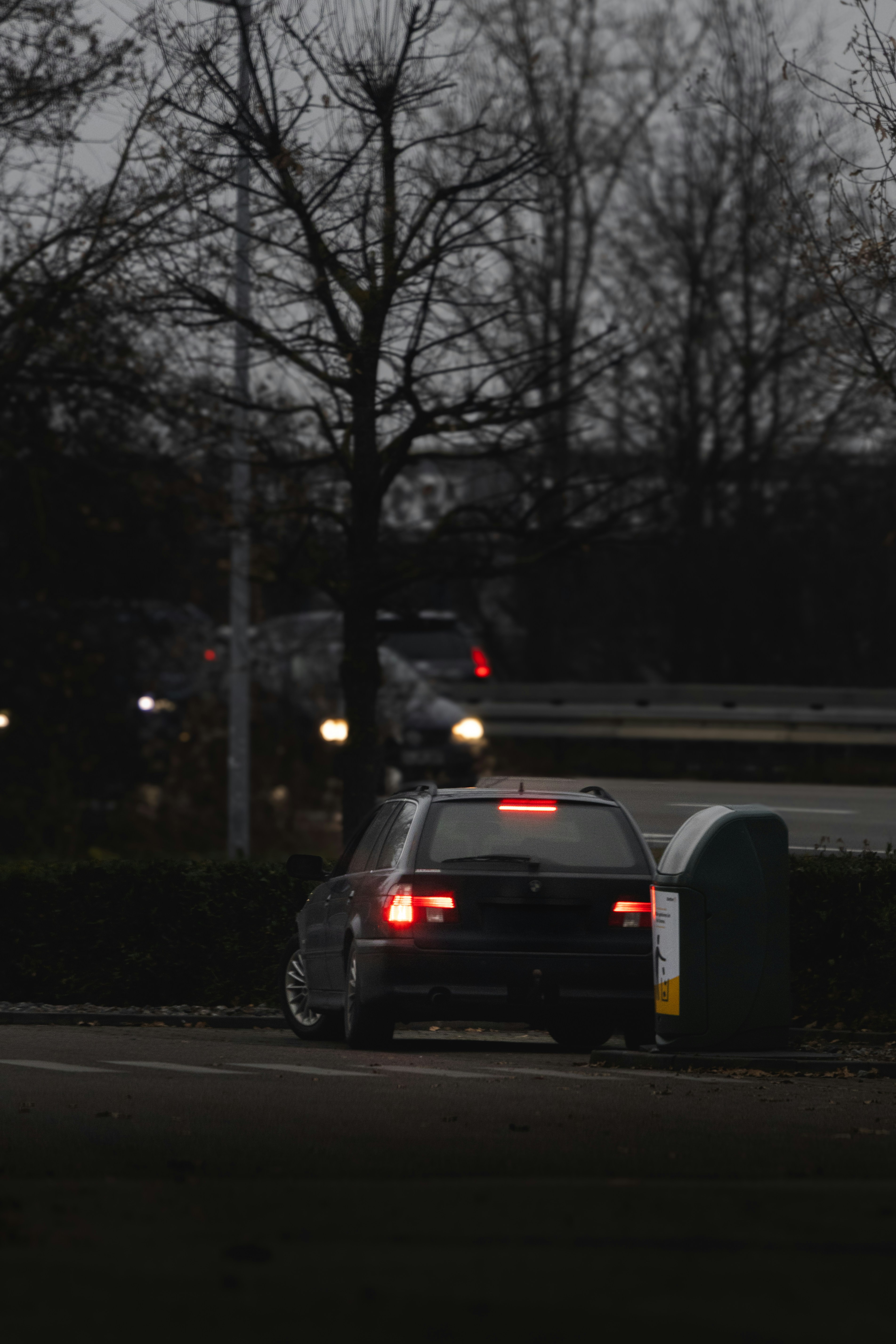 Evening Stop: Tail Lights in a Quiet Parking Lot