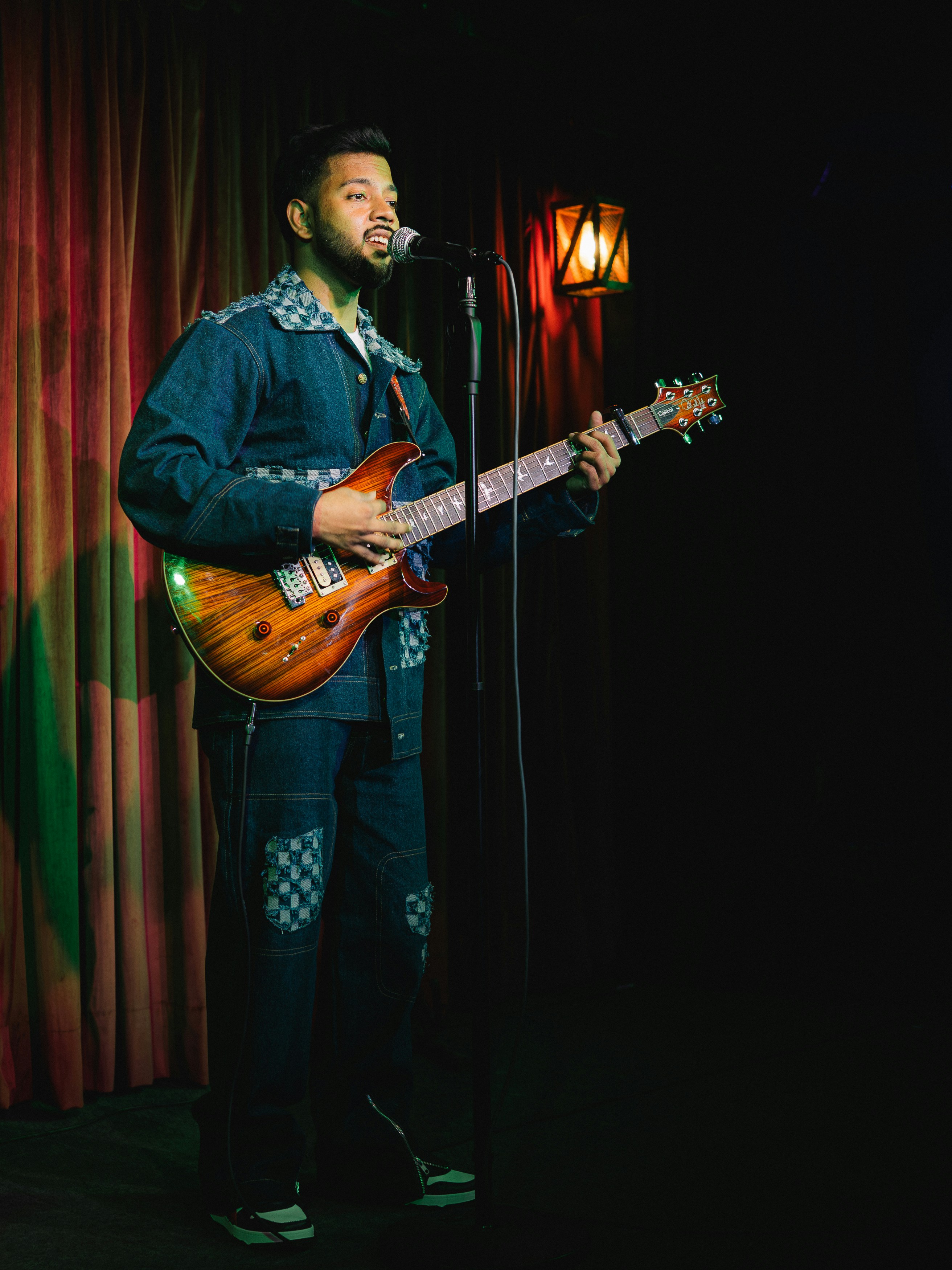 Guitarist in Neon Stage Lights