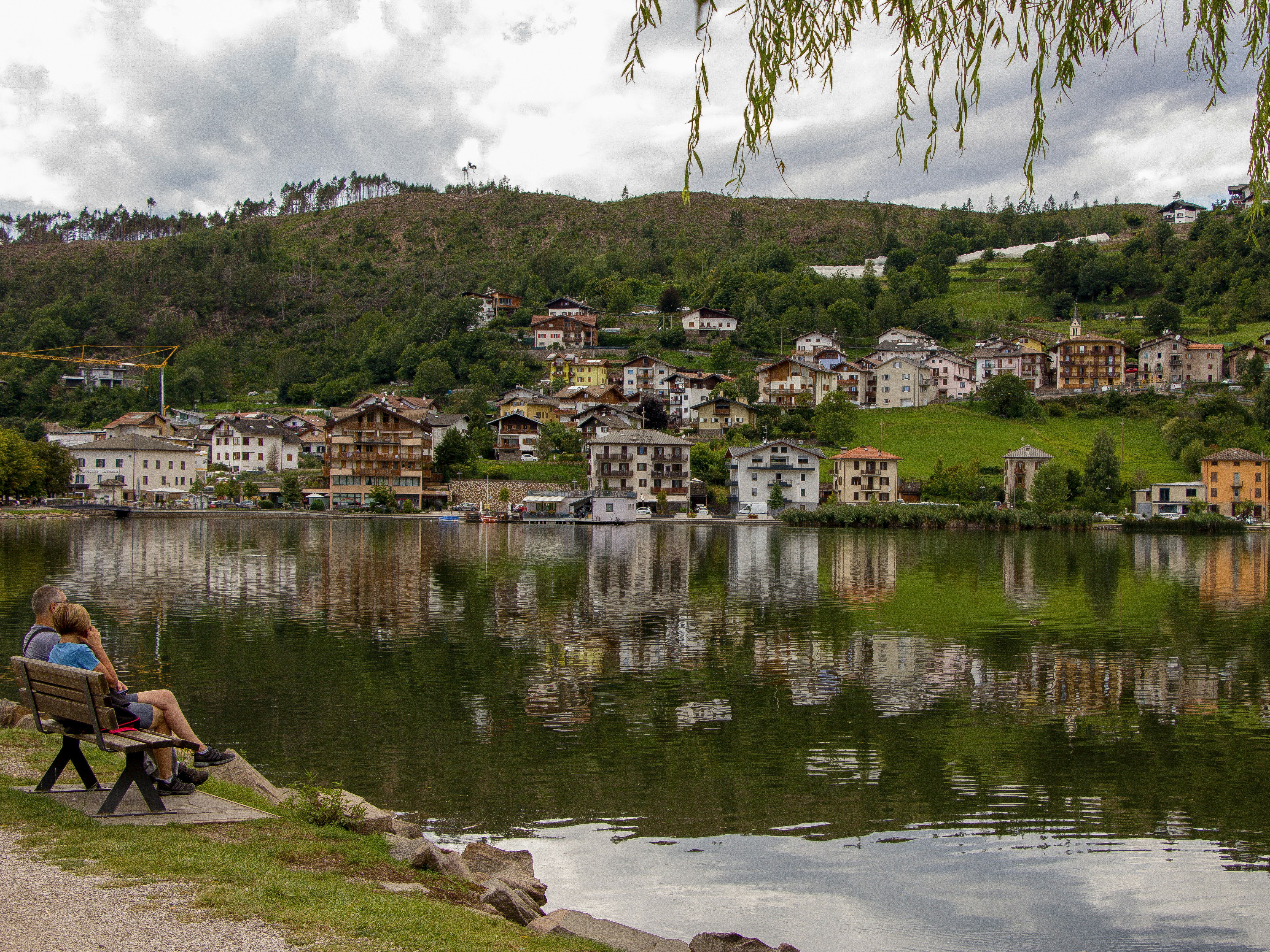 Quiet lakeside village mirrored in still water