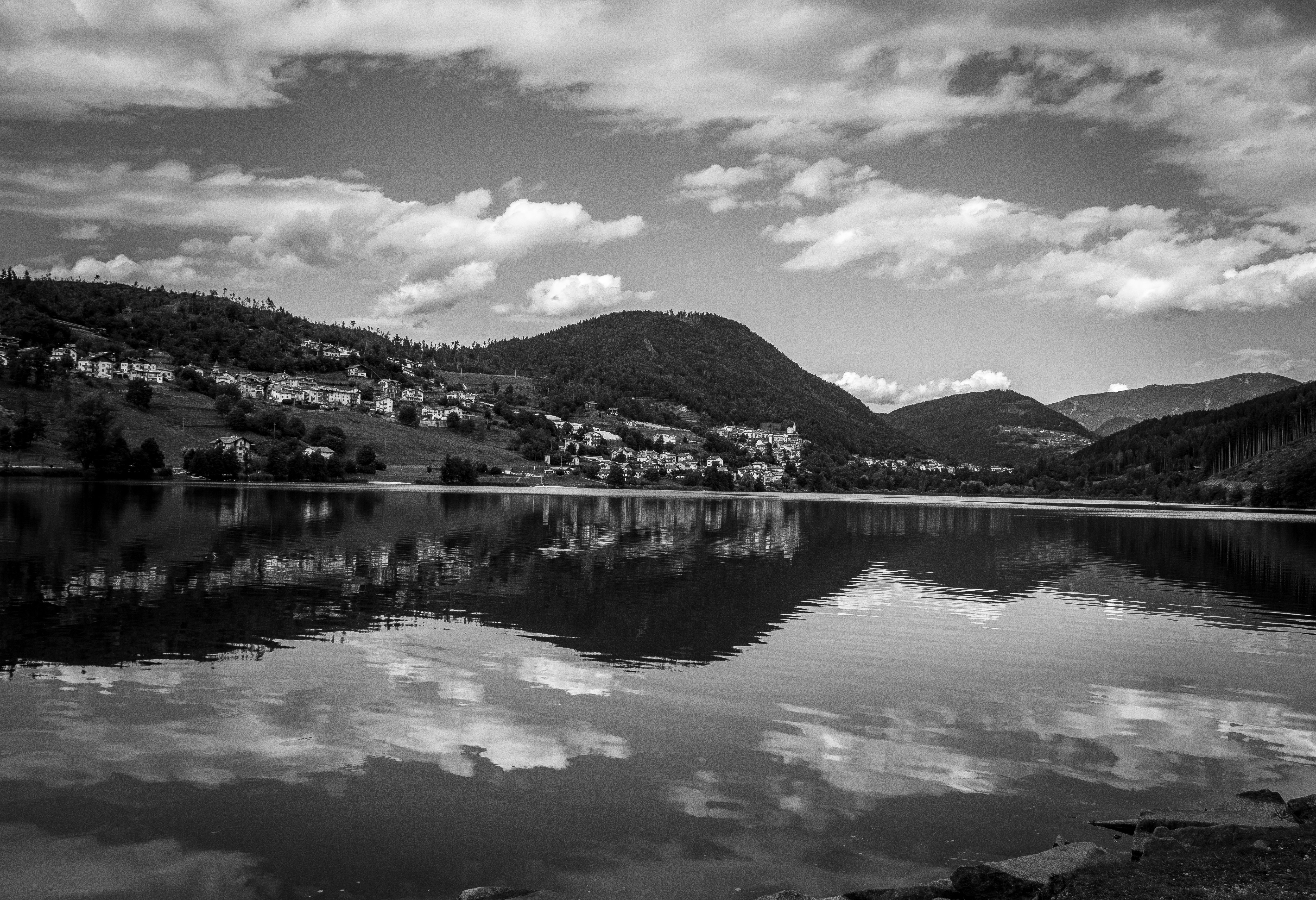 A Quiet Lake Crowned by Hills and Clouds