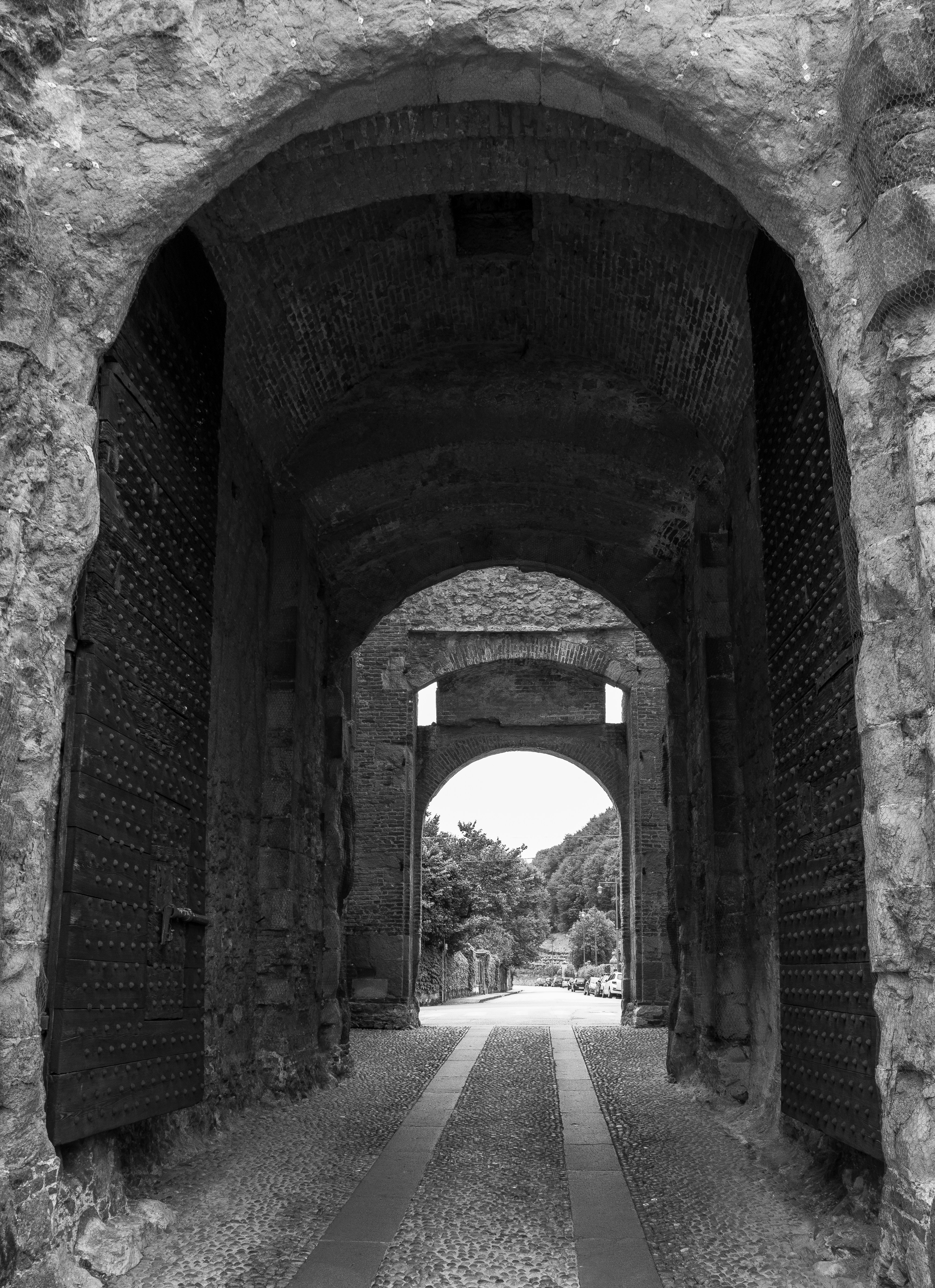 Through the Ancient Gate: A Stone Corridor Framing Light Beyond