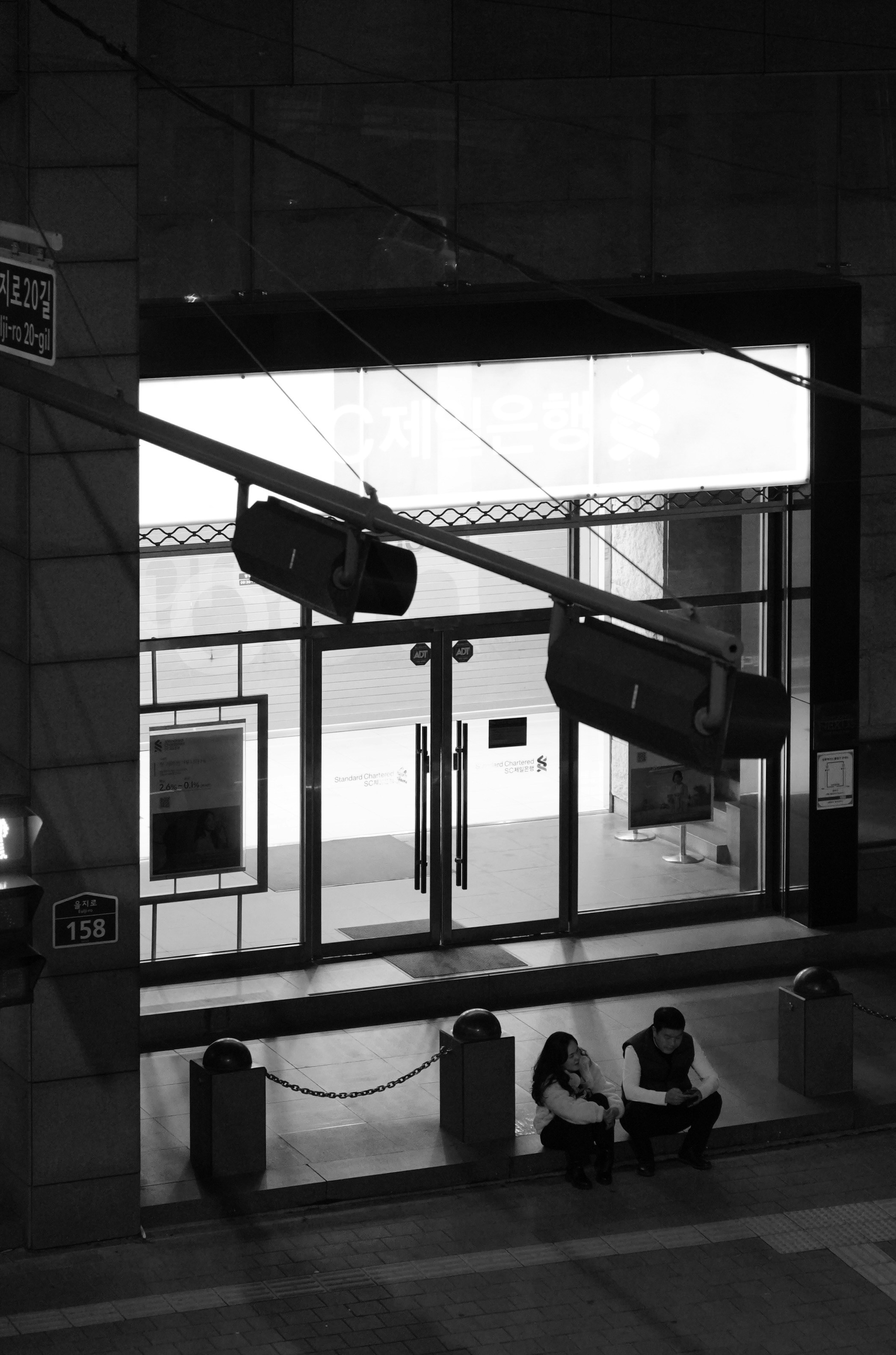 Midnight Pause at the Streetfront