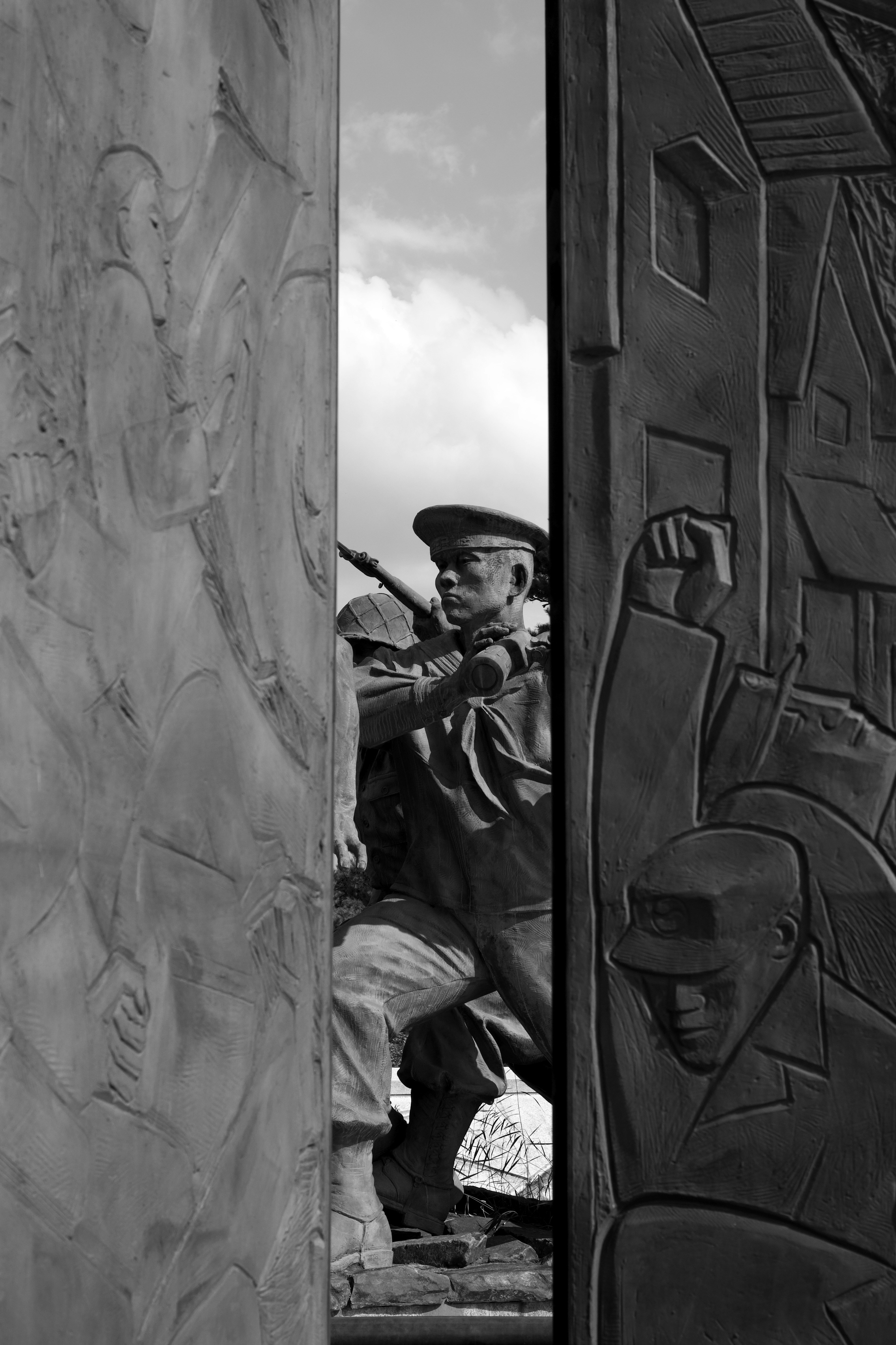 Between Pillars: Soldier Emerging Through a Narrow Gap