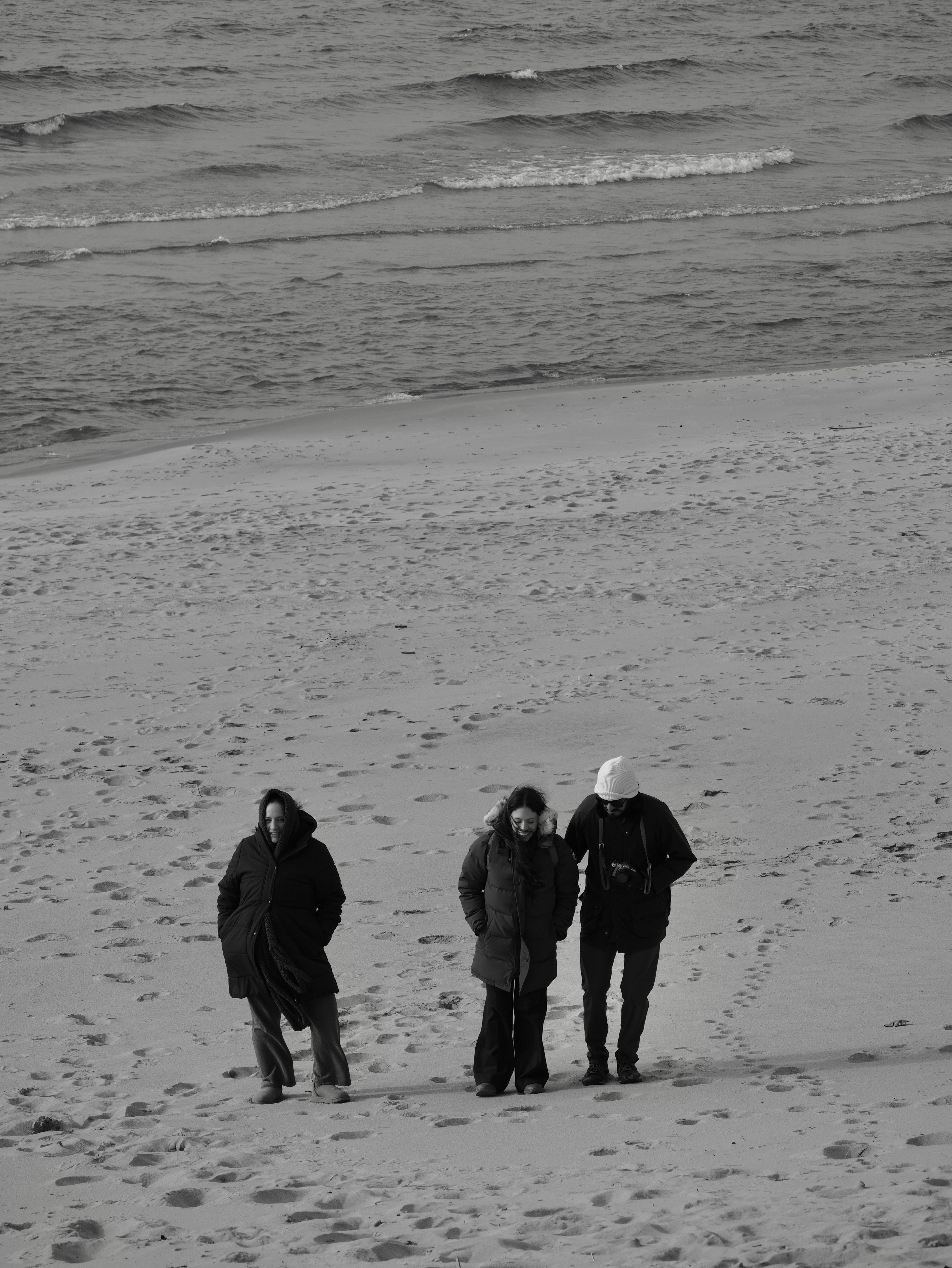Footsteps on the Quiet Shore: A Trio Walks into the Mist
