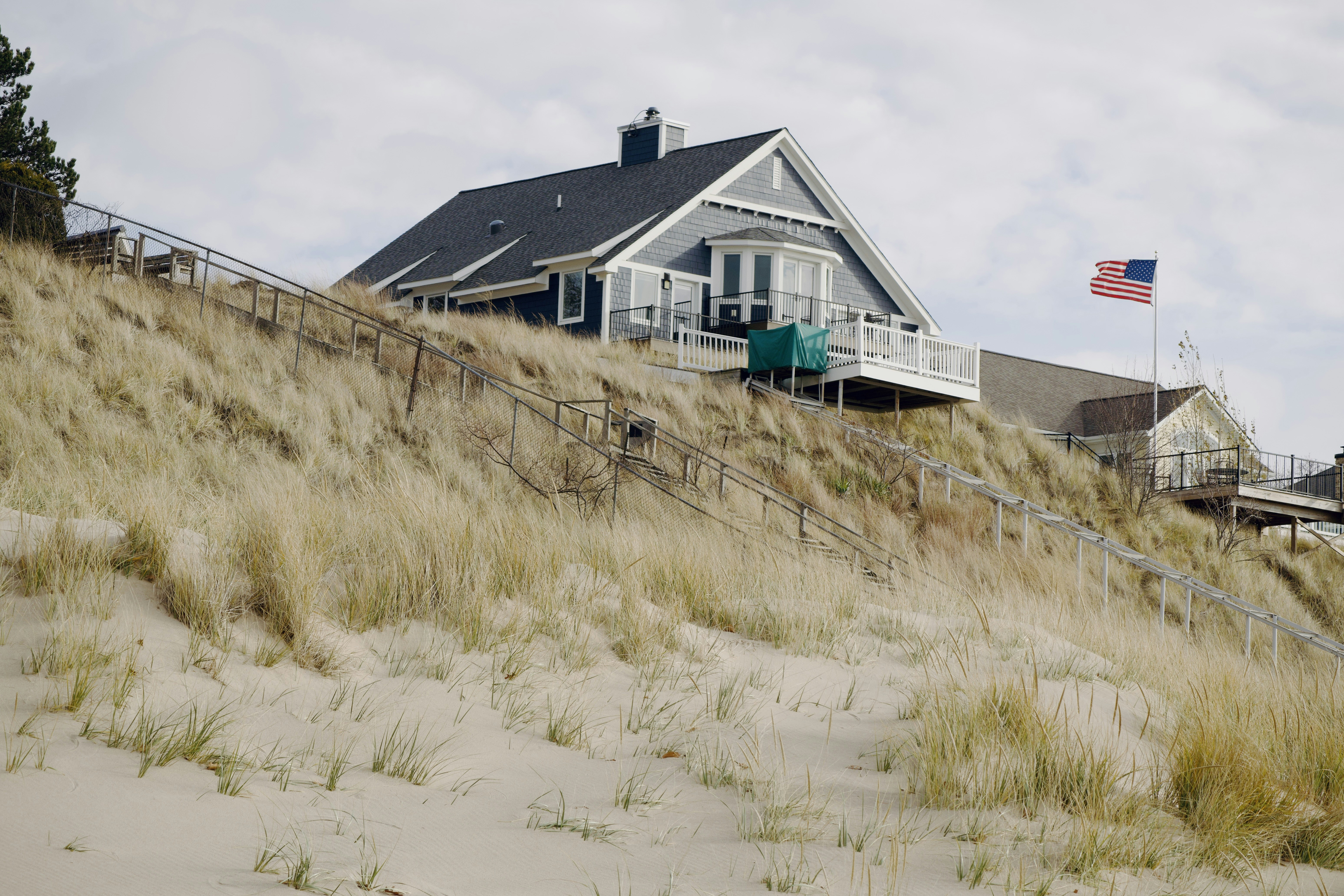 Coastal Haven: Seaside Cottage Cushioned by Dune Grass