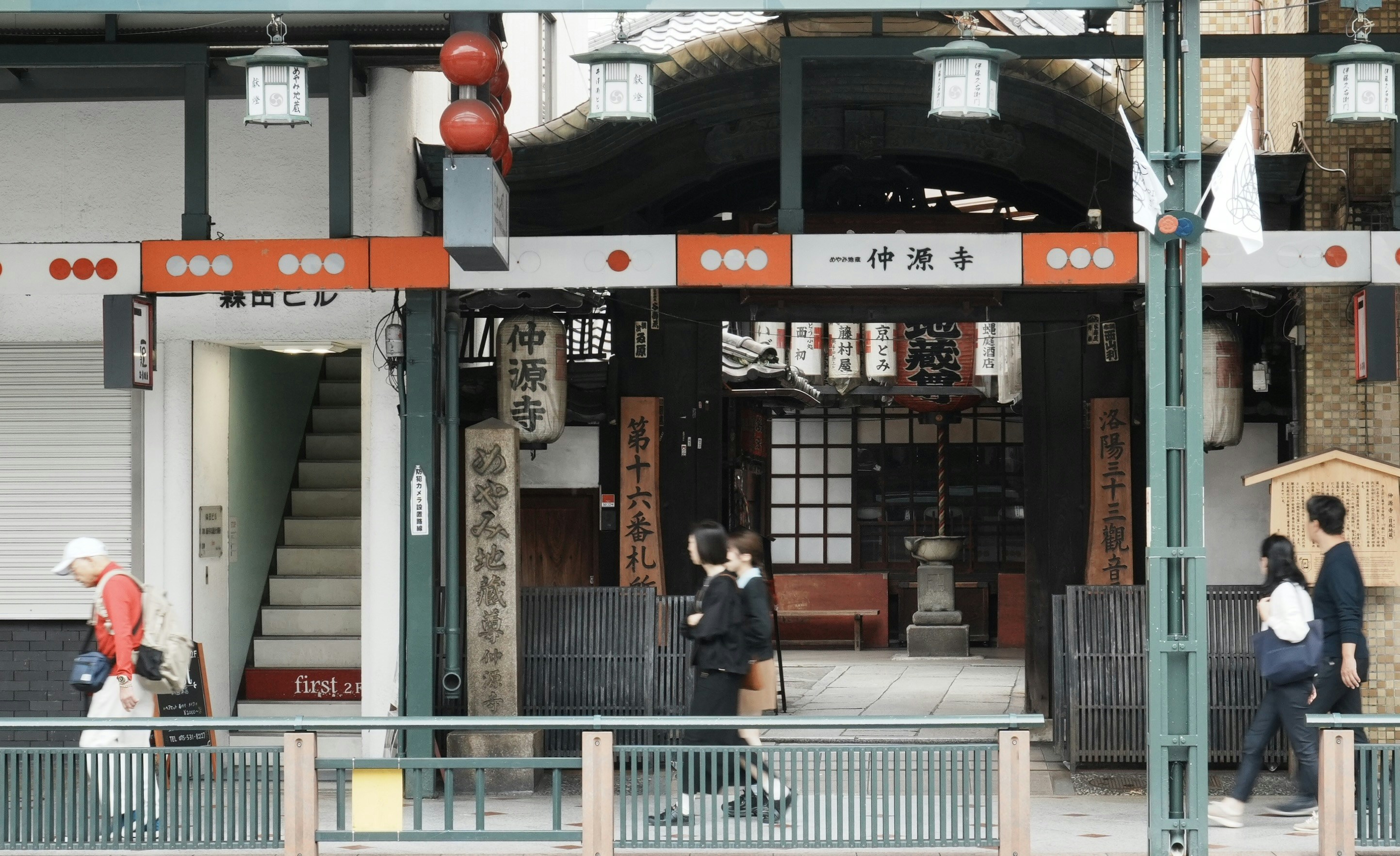 Gateway of Quiet Movements: A Glassy Street Between Lanterns