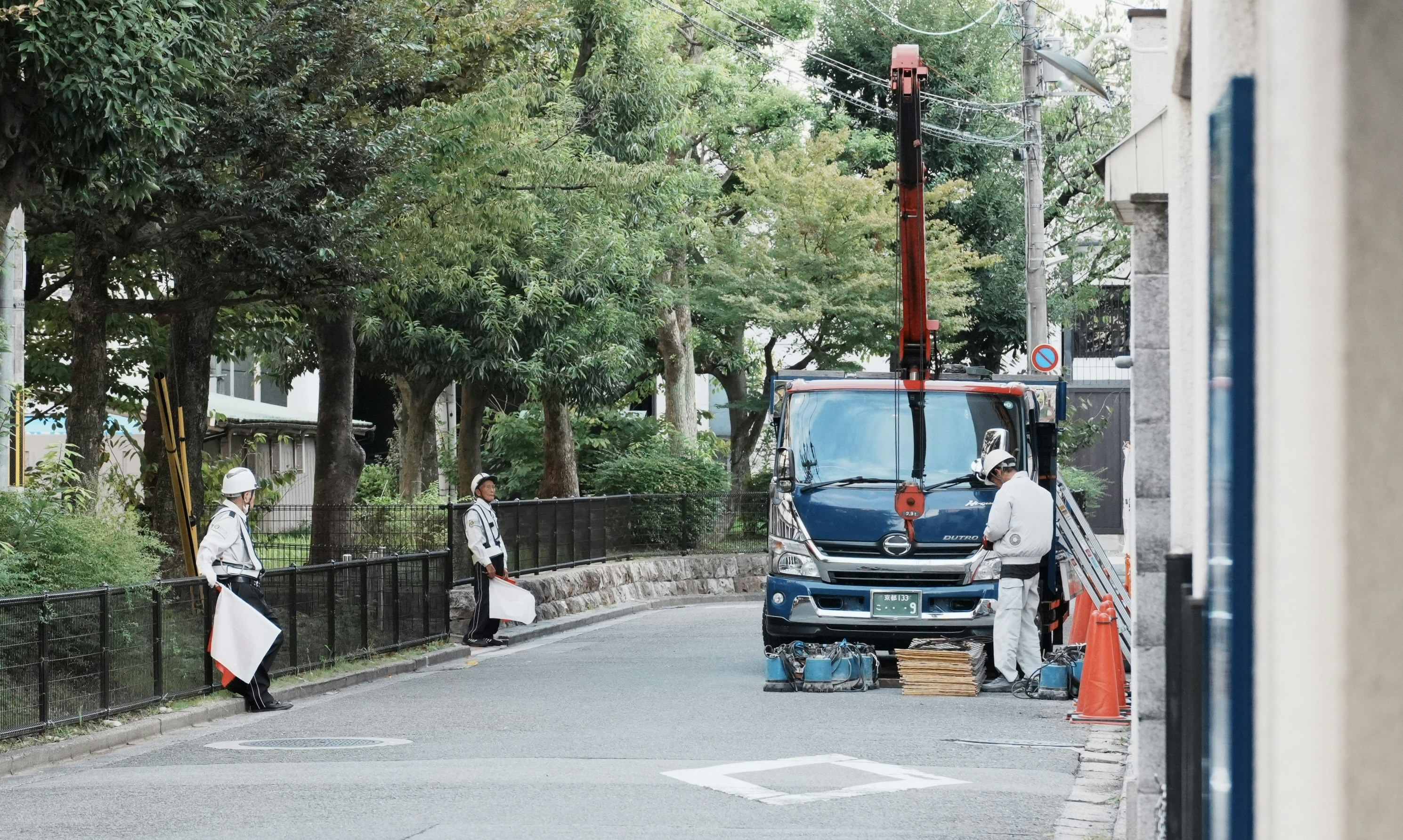 Streetwork in Progress: Crew at the Quiet Curbside