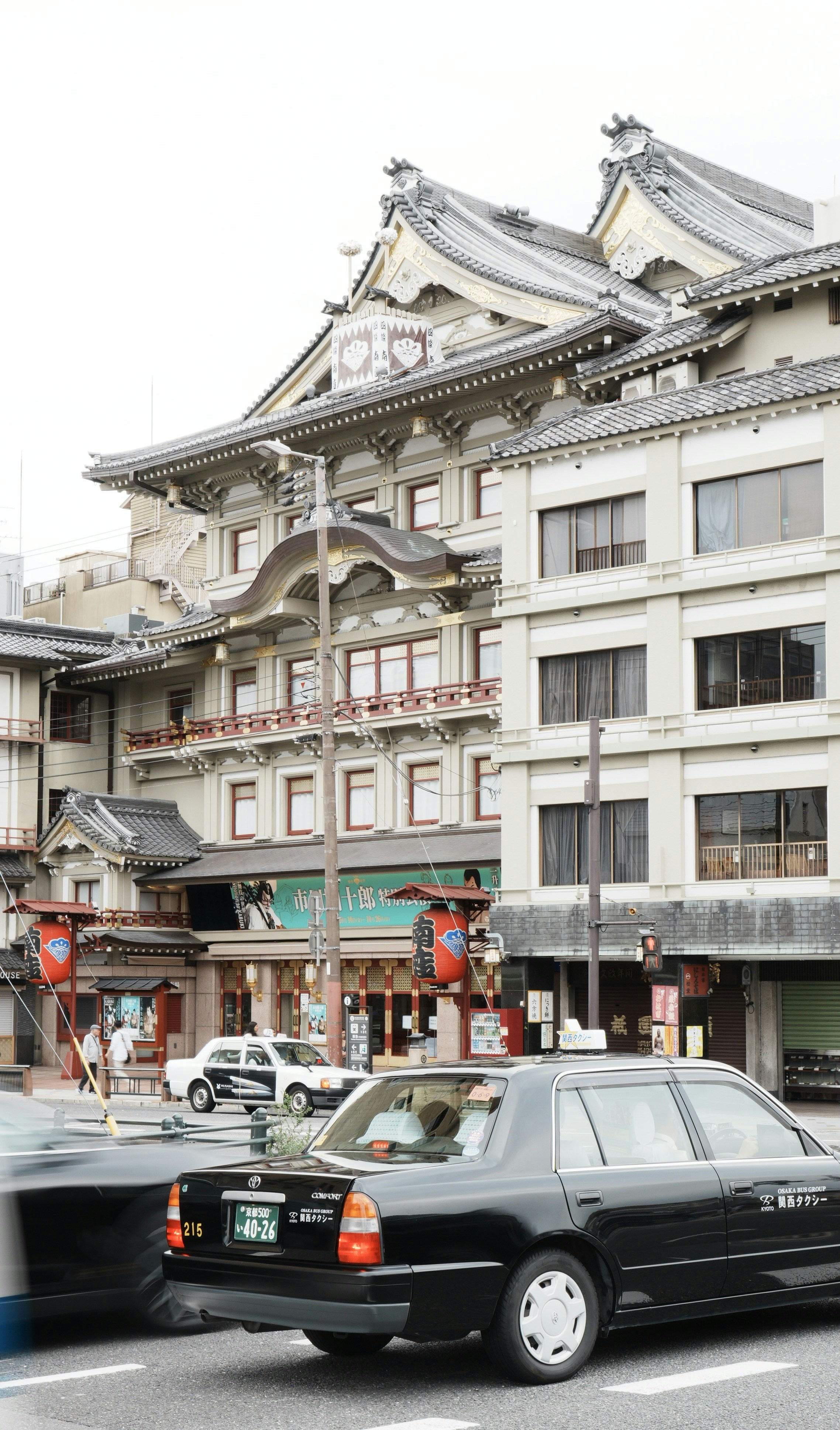 Streetcar Route Past a Traditional Japanese Facade